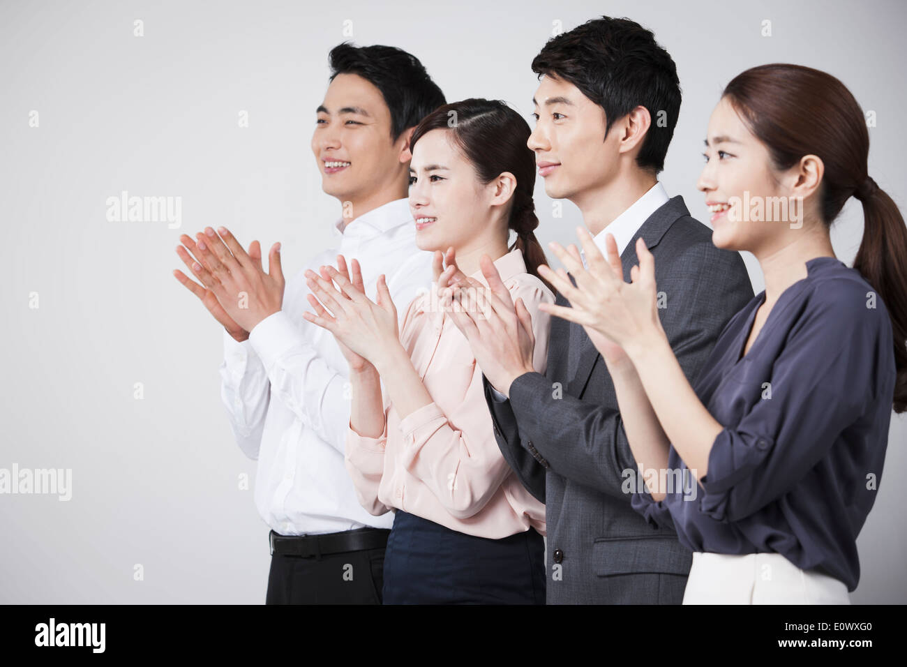 Woman clapping hands smiling hi-res stock photography and images - Alamy