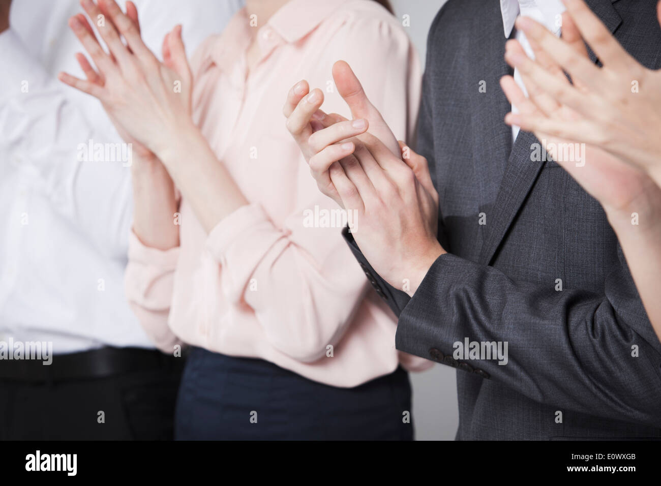 business people clapping their hands Stock Photo - Alamy