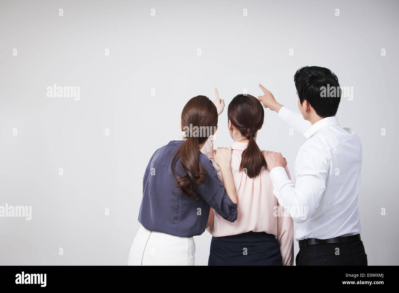 business people looking at something Stock Photo - Alamy