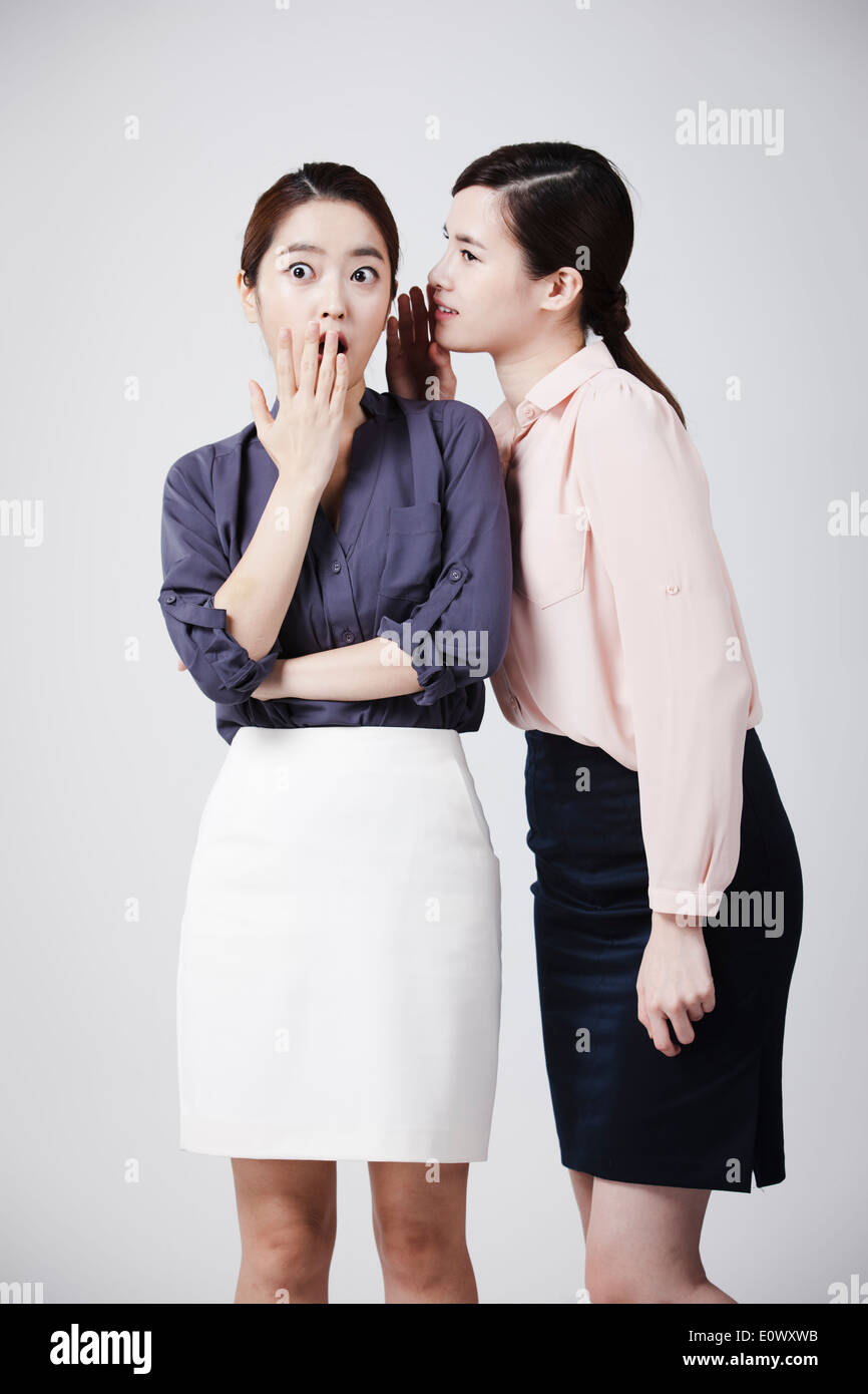 Two gossiping hi-res stock photography and images - Alamy