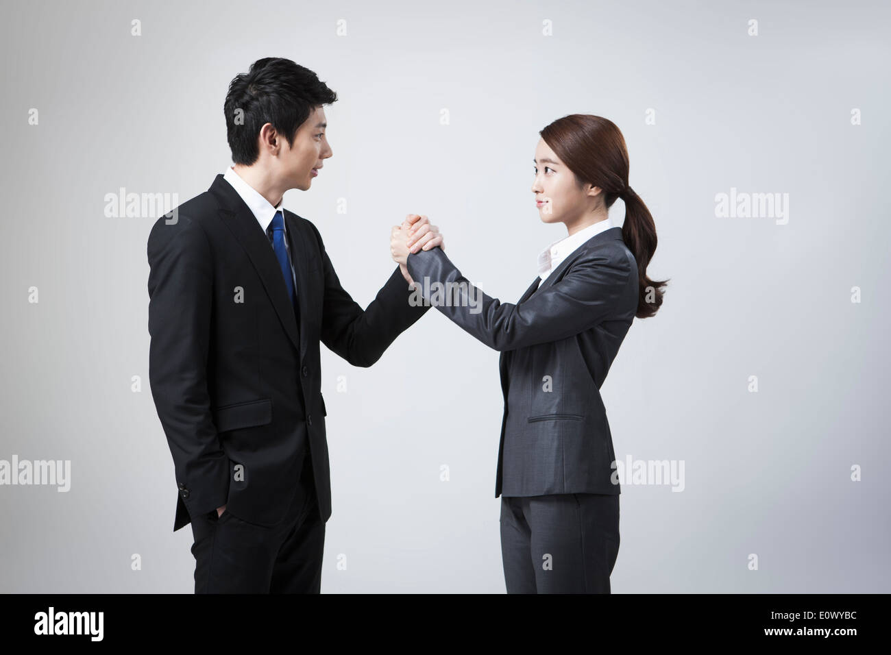 two business people posing Stock Photo - Alamy