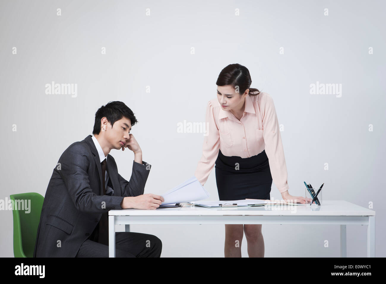 Two business people thinking hi-res stock photography and images - Alamy