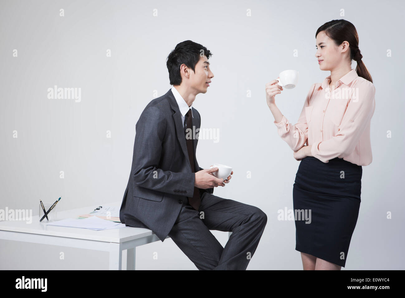 two business people having coffee Stock Photo - Alamy