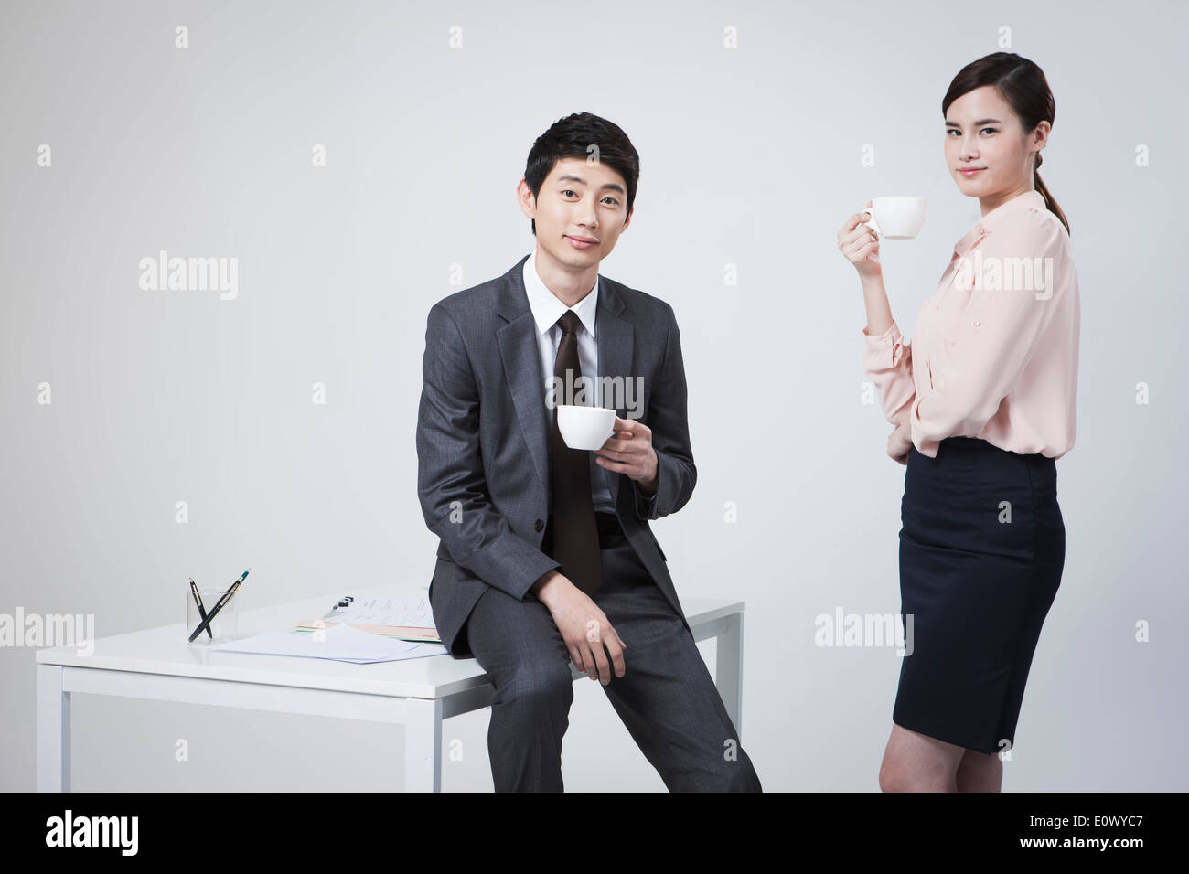 two business people having coffee Stock Photo - Alamy