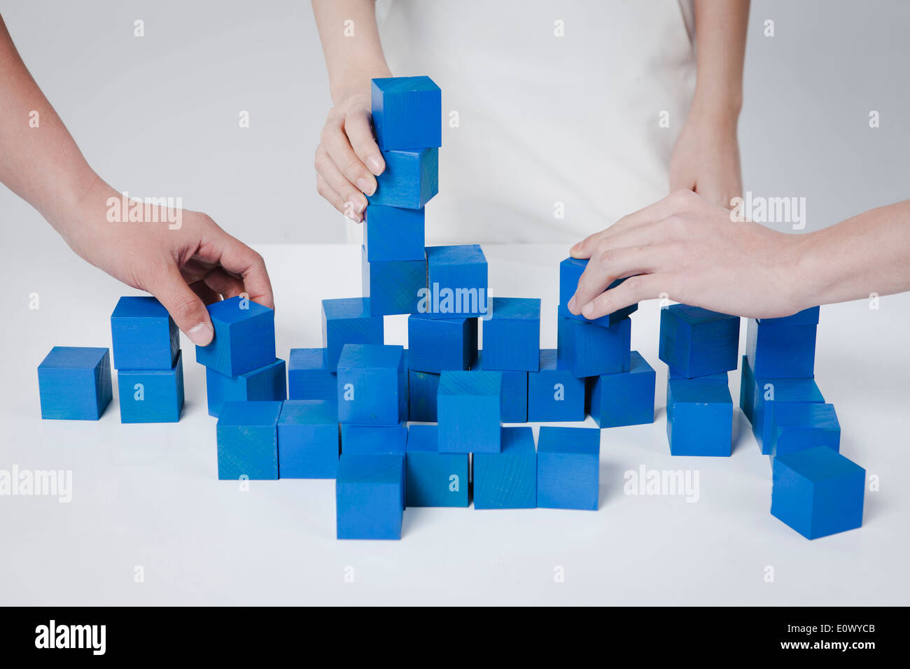 Business people holding cubes hi-res stock photography and images - Alamy