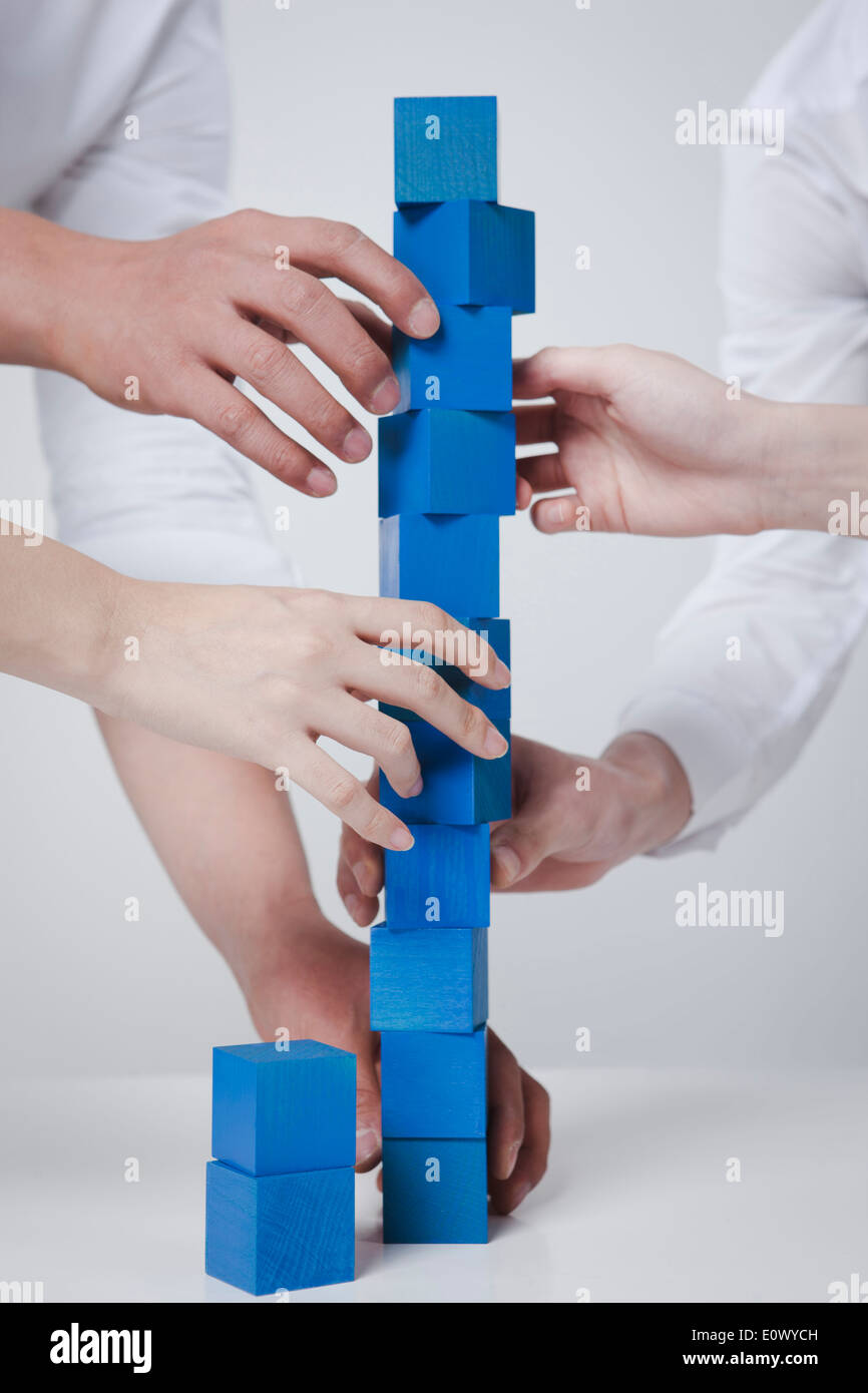 Business people holding cubes hi-res stock photography and images - Alamy