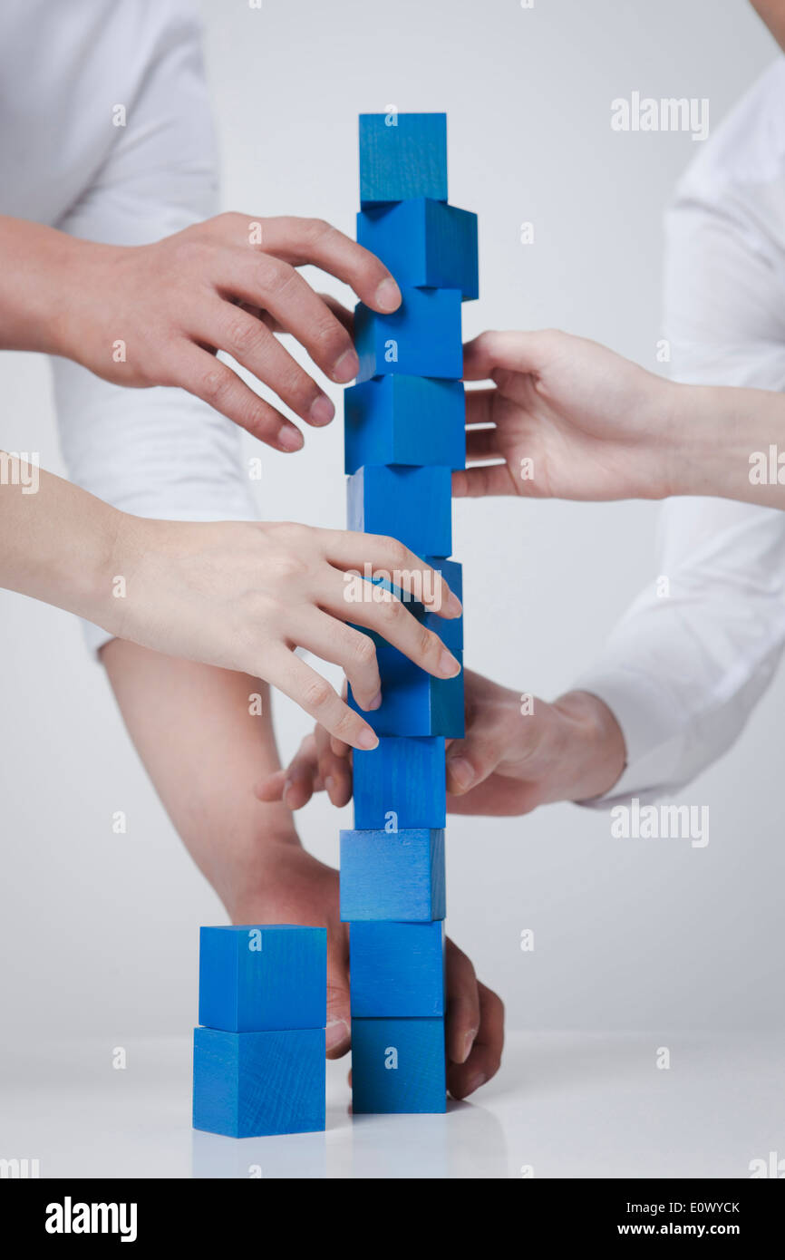 Business people holding cubes hi-res stock photography and images - Alamy