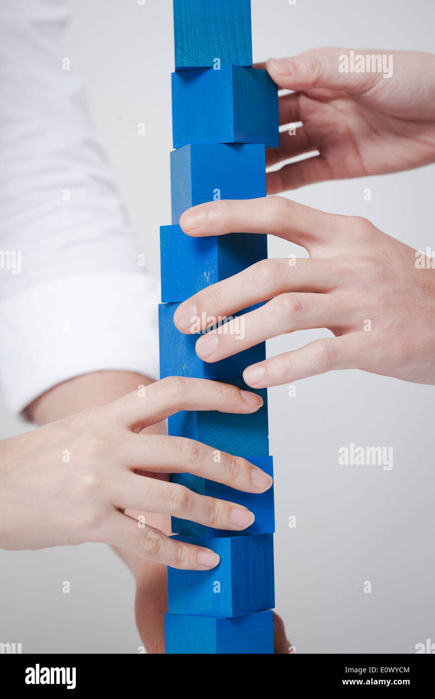 Business people holding cubes hi-res stock photography and images - Alamy