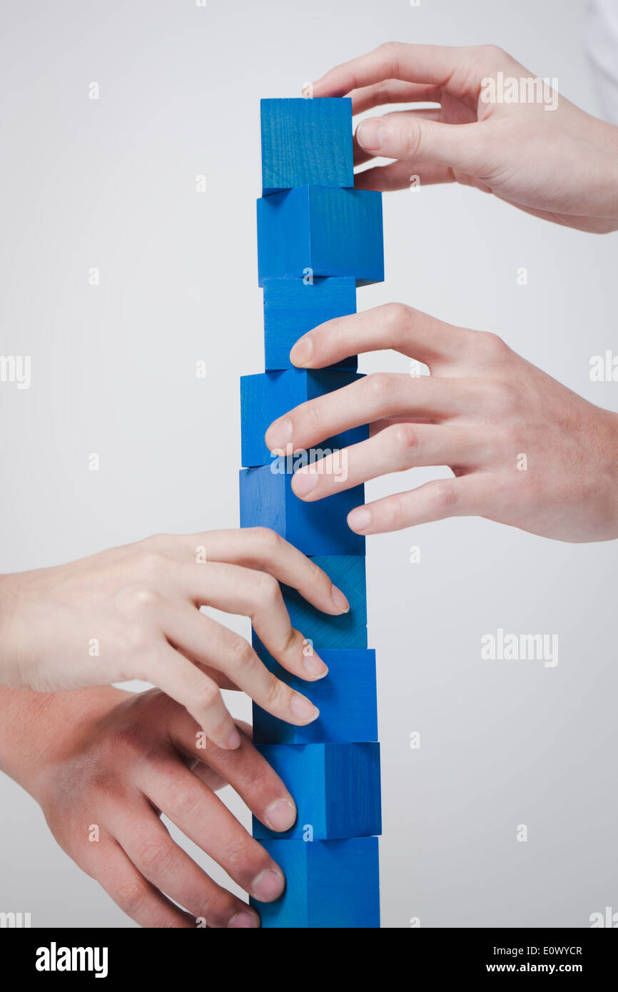 Business people holding cubes hi-res stock photography and images - Alamy