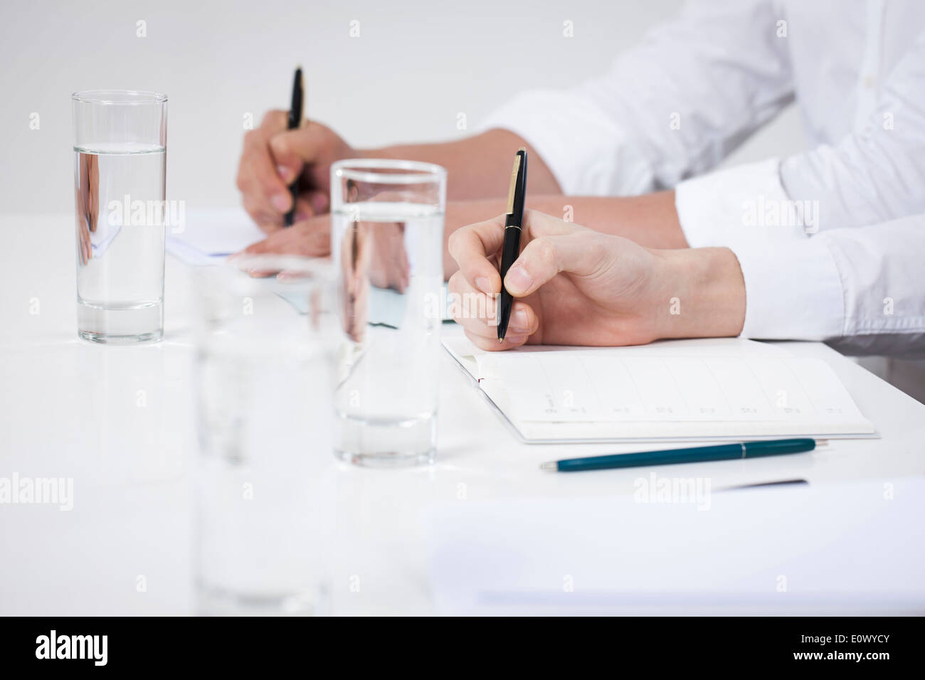 people writing on paper Stock Photo - Alamy