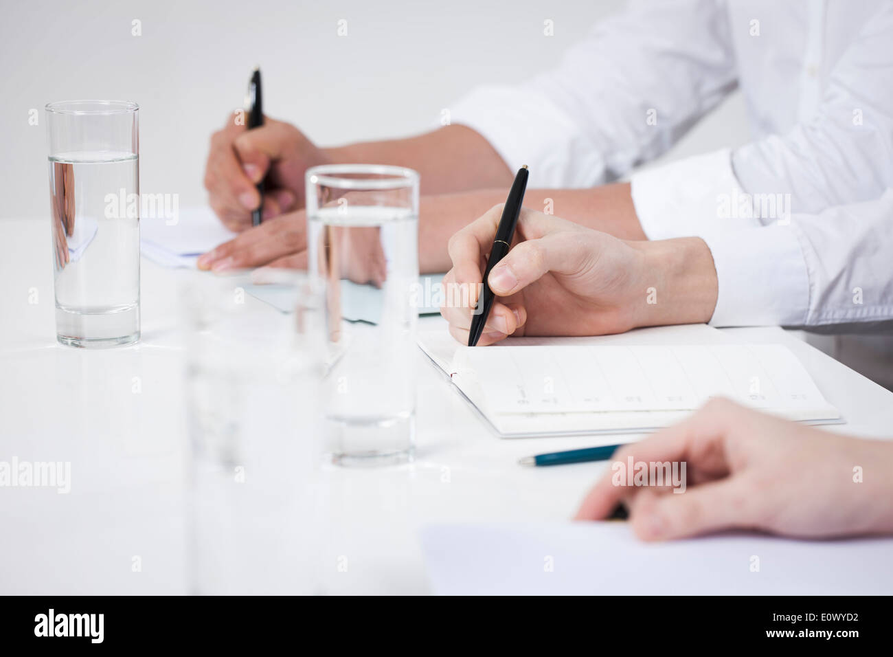 people writing on paper Stock Photo - Alamy