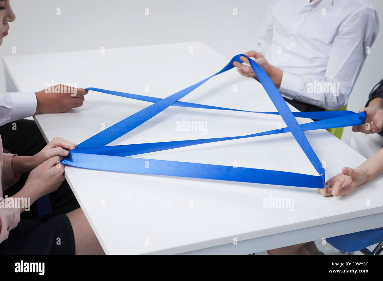 people making shapes with a band Stock Photo - Alamy