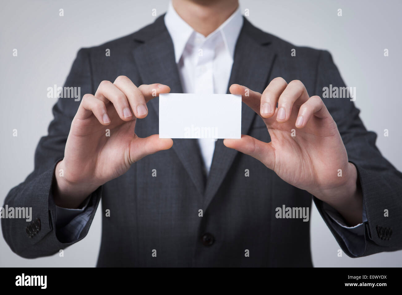 a business man holding a copy space Stock Photo - Alamy