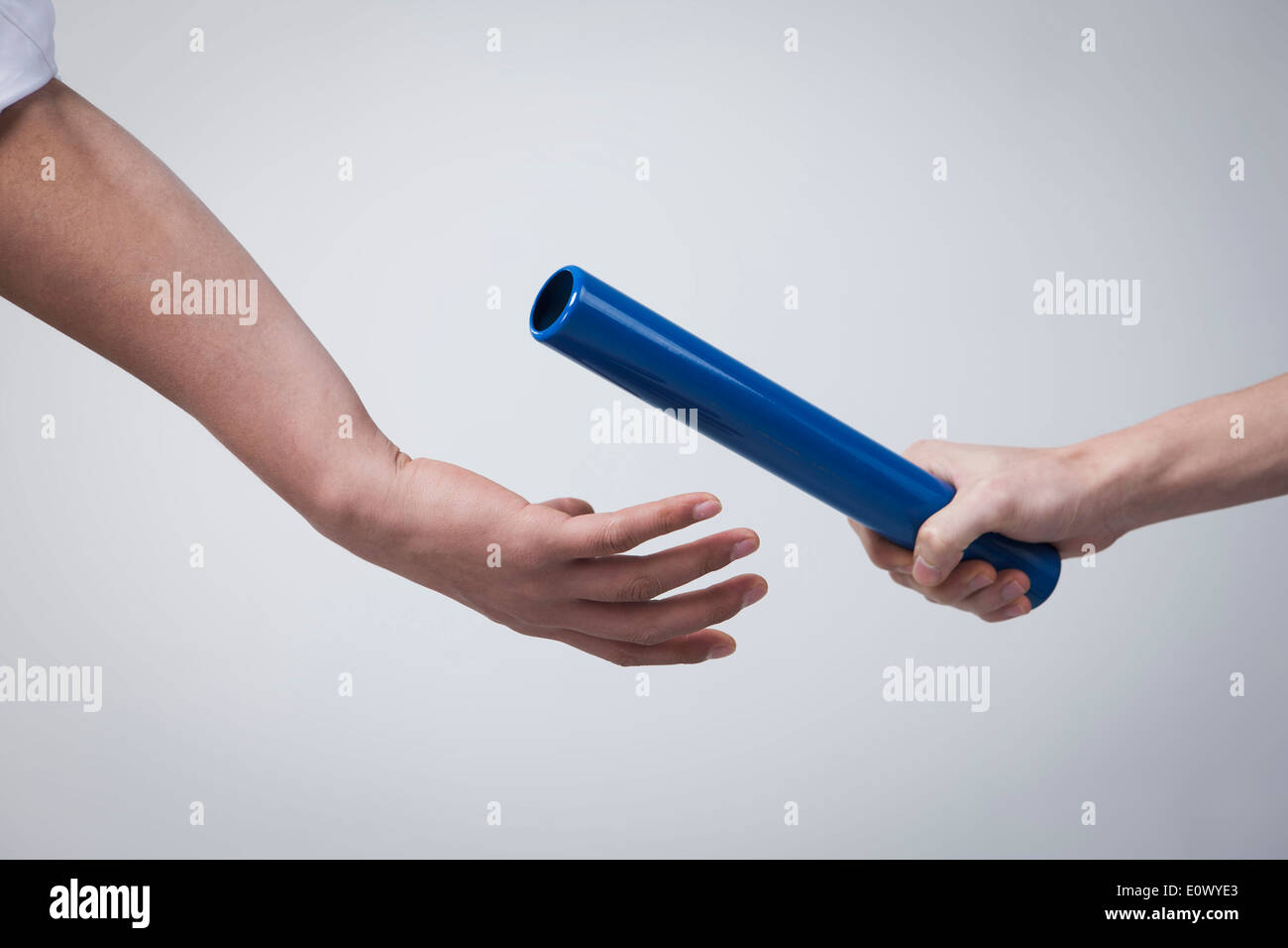 Relay baton hand hi-res stock photography and images - Alamy