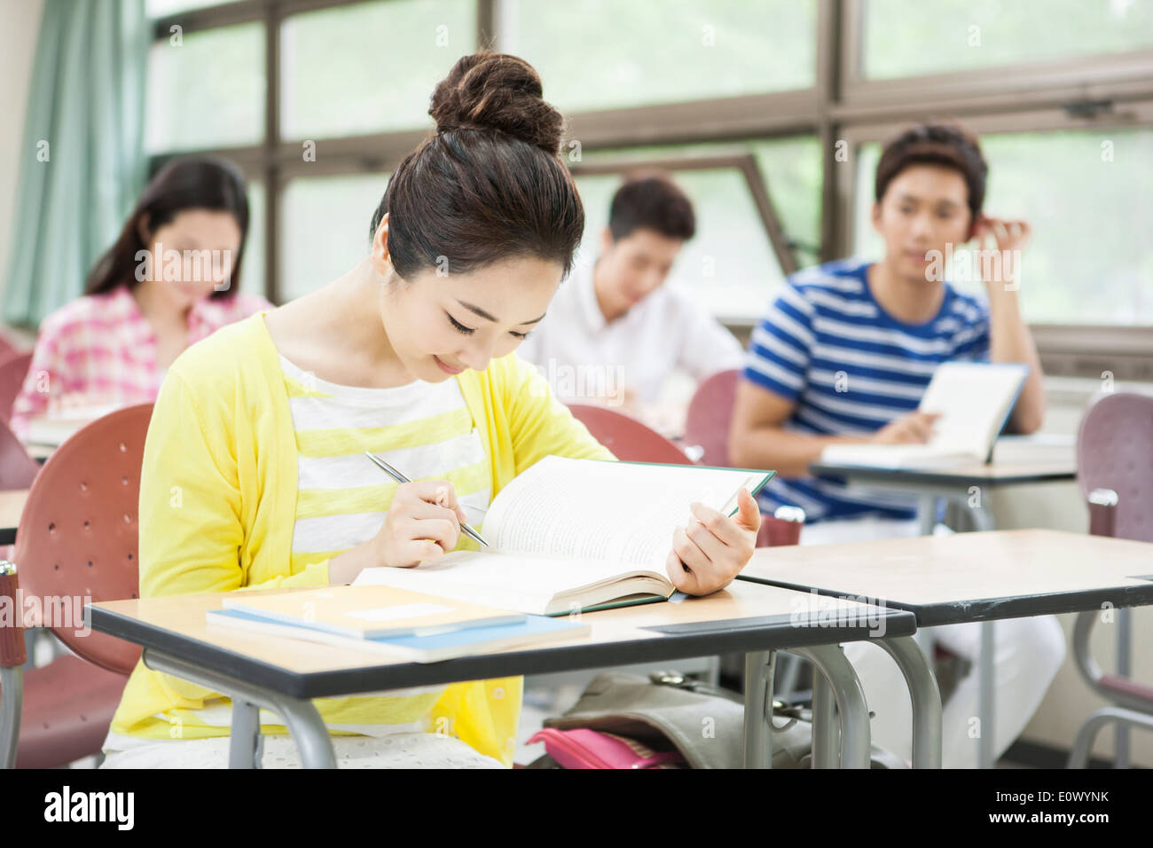 a woman studying in class Stock Photo - Alamy