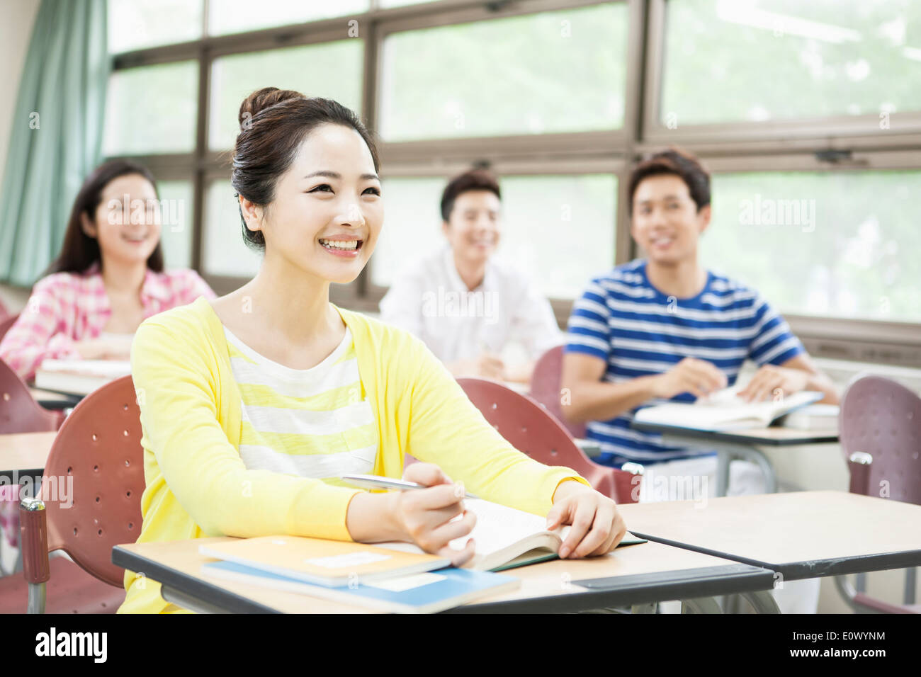 a woman studying in class Stock Photo - Alamy