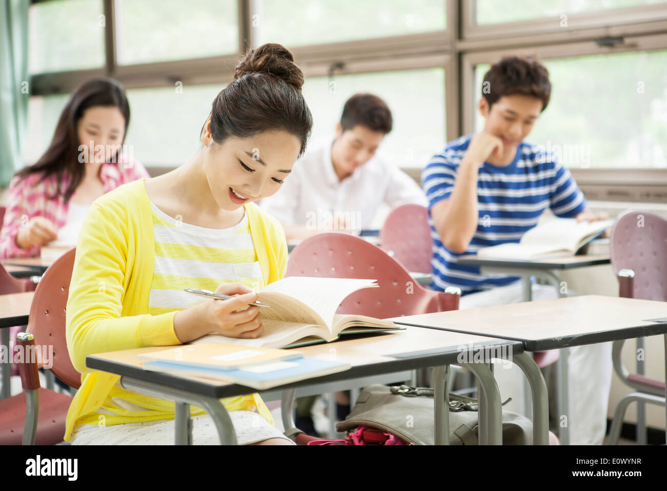 a woman studying in class Stock Photo - Alamy