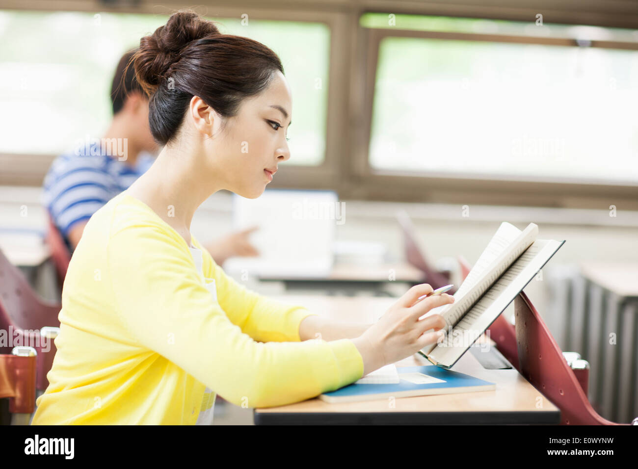 a woman studying in class Stock Photo - Alamy
