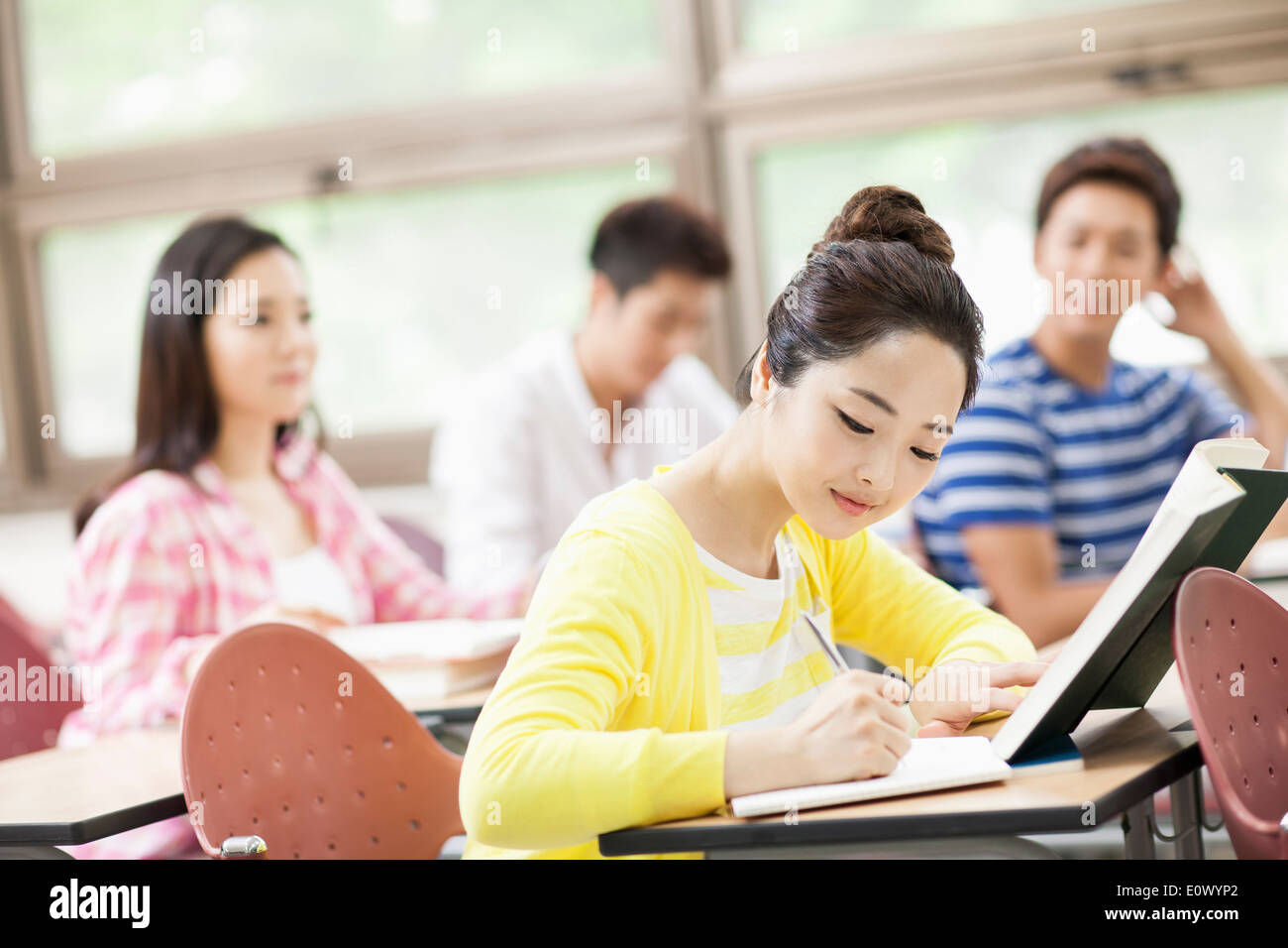 a woman studying in class Stock Photo - Alamy