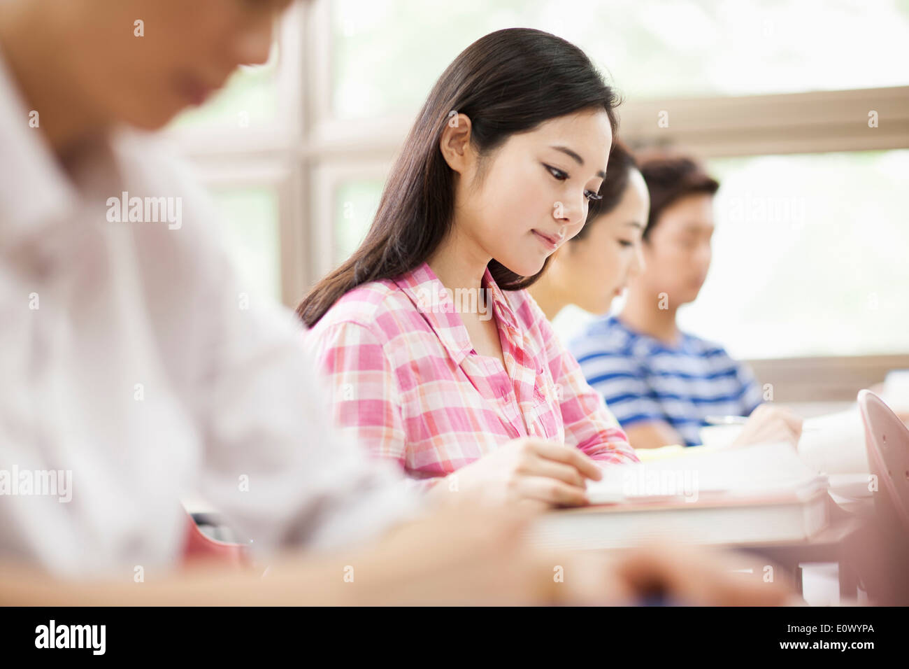 a woman studying in class Stock Photo - Alamy