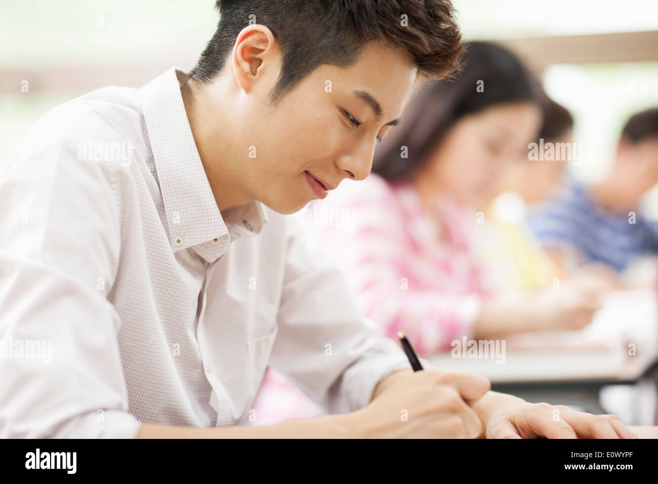 a man studying in class Stock Photo - Alamy