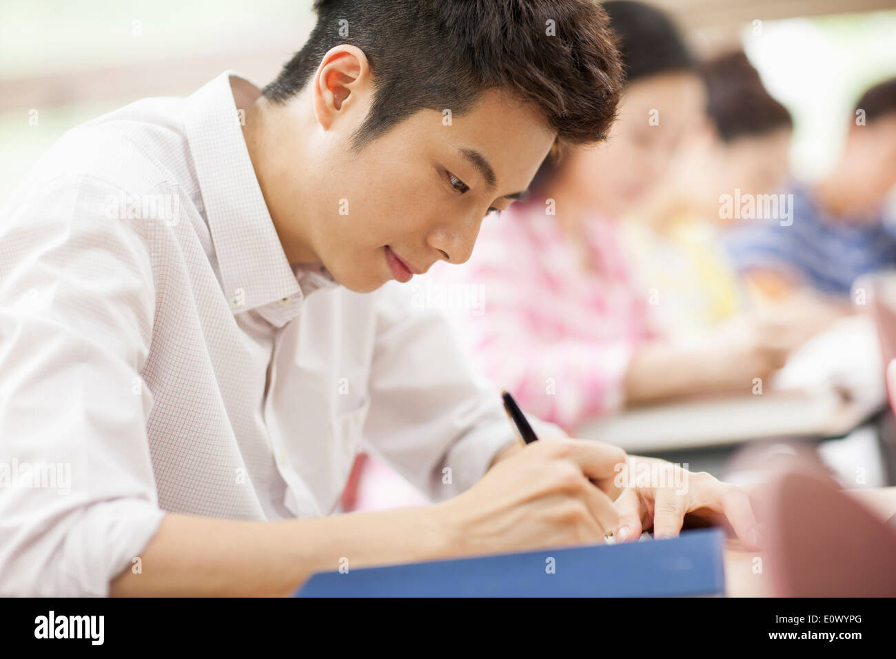 a man studying in class Stock Photo - Alamy