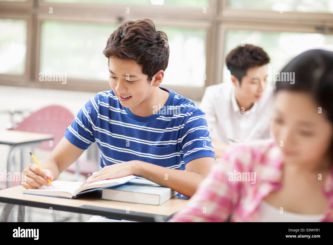 a man studying in class Stock Photo - Alamy