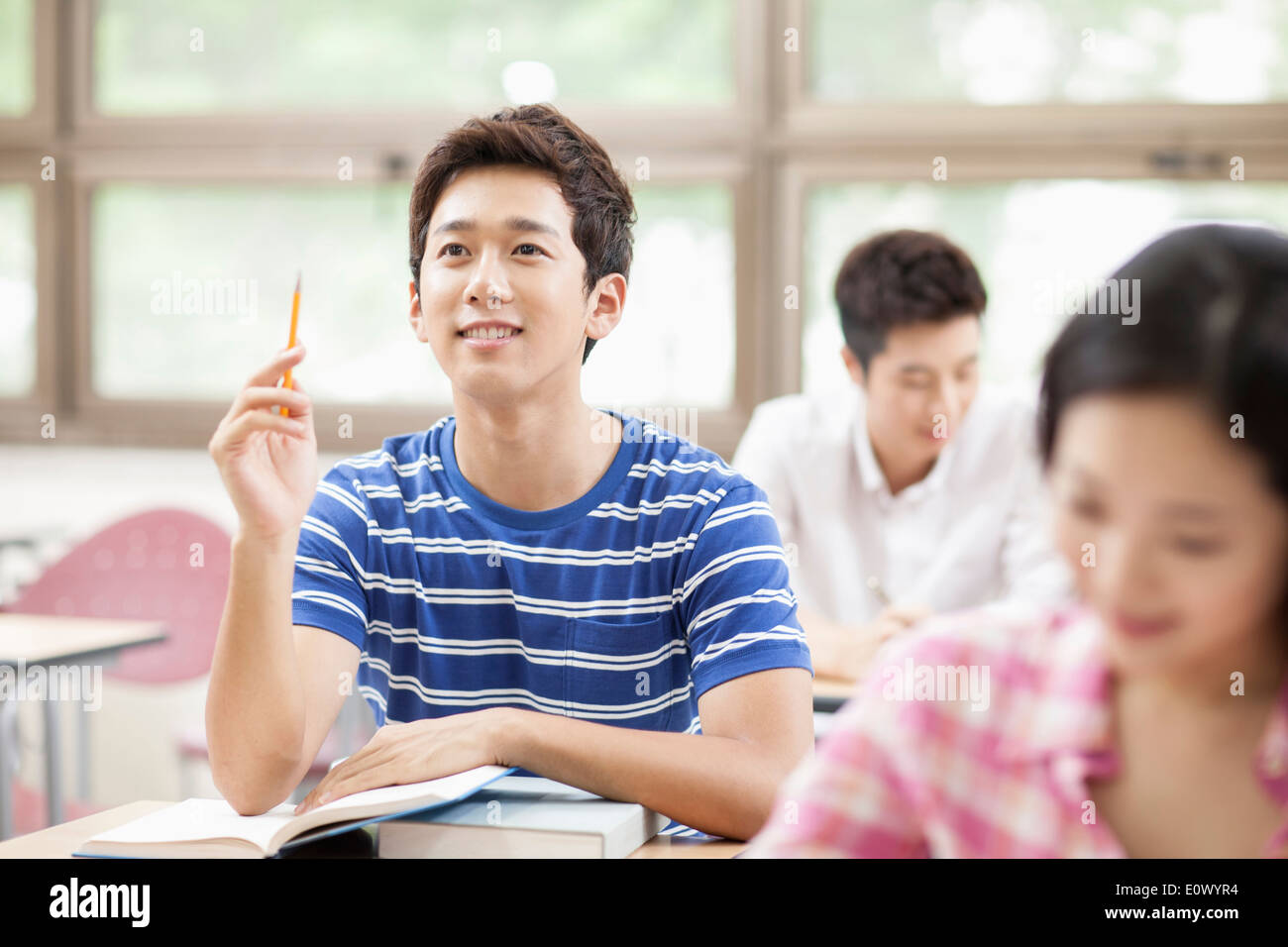 a man studying in class Stock Photo - Alamy