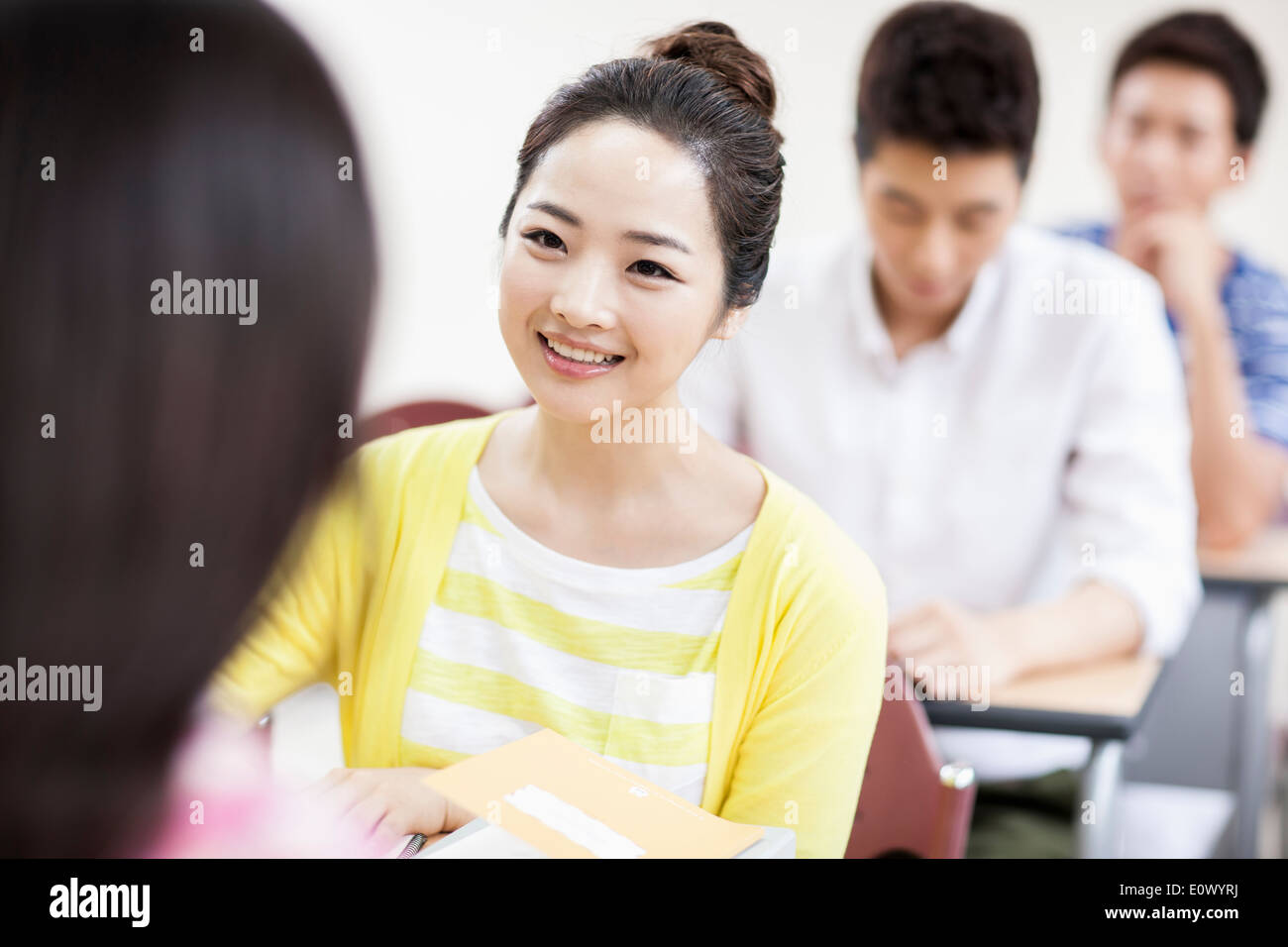 a woman studying in class Stock Photo - Alamy