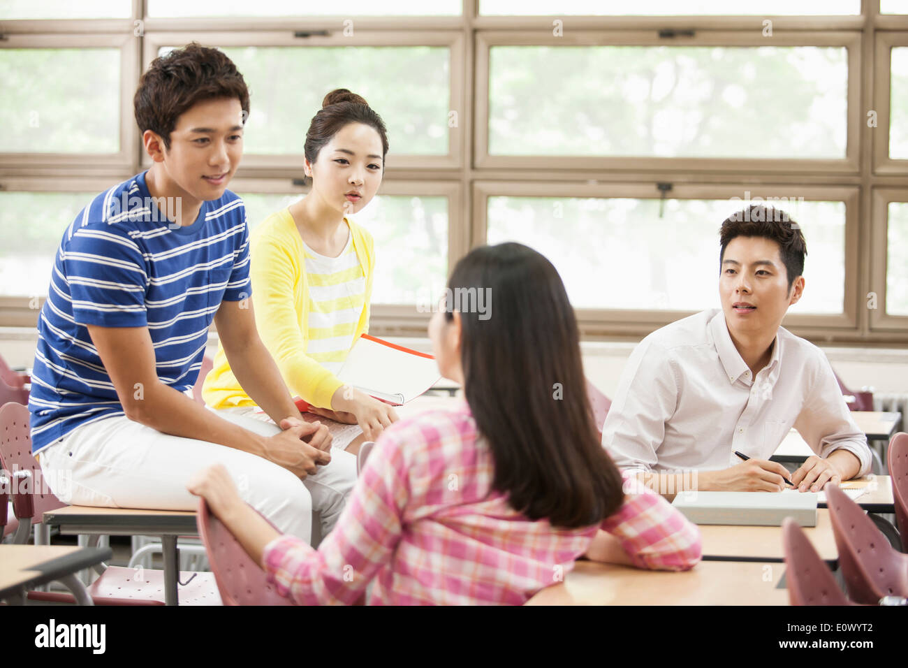 people chatting in the class room Stock Photo - Alamy