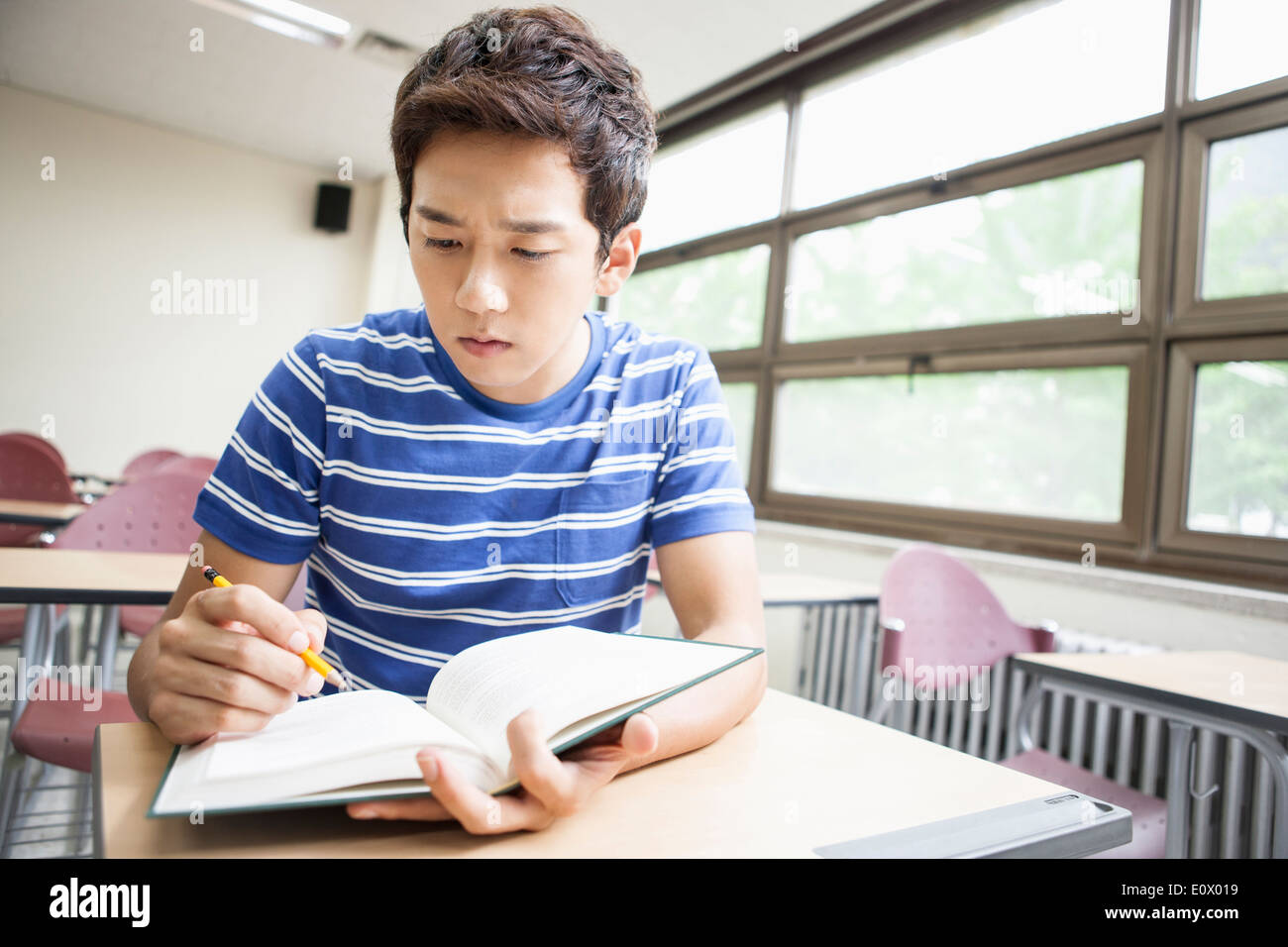 Young man brown hair college hi-res stock photography and images - Alamy
