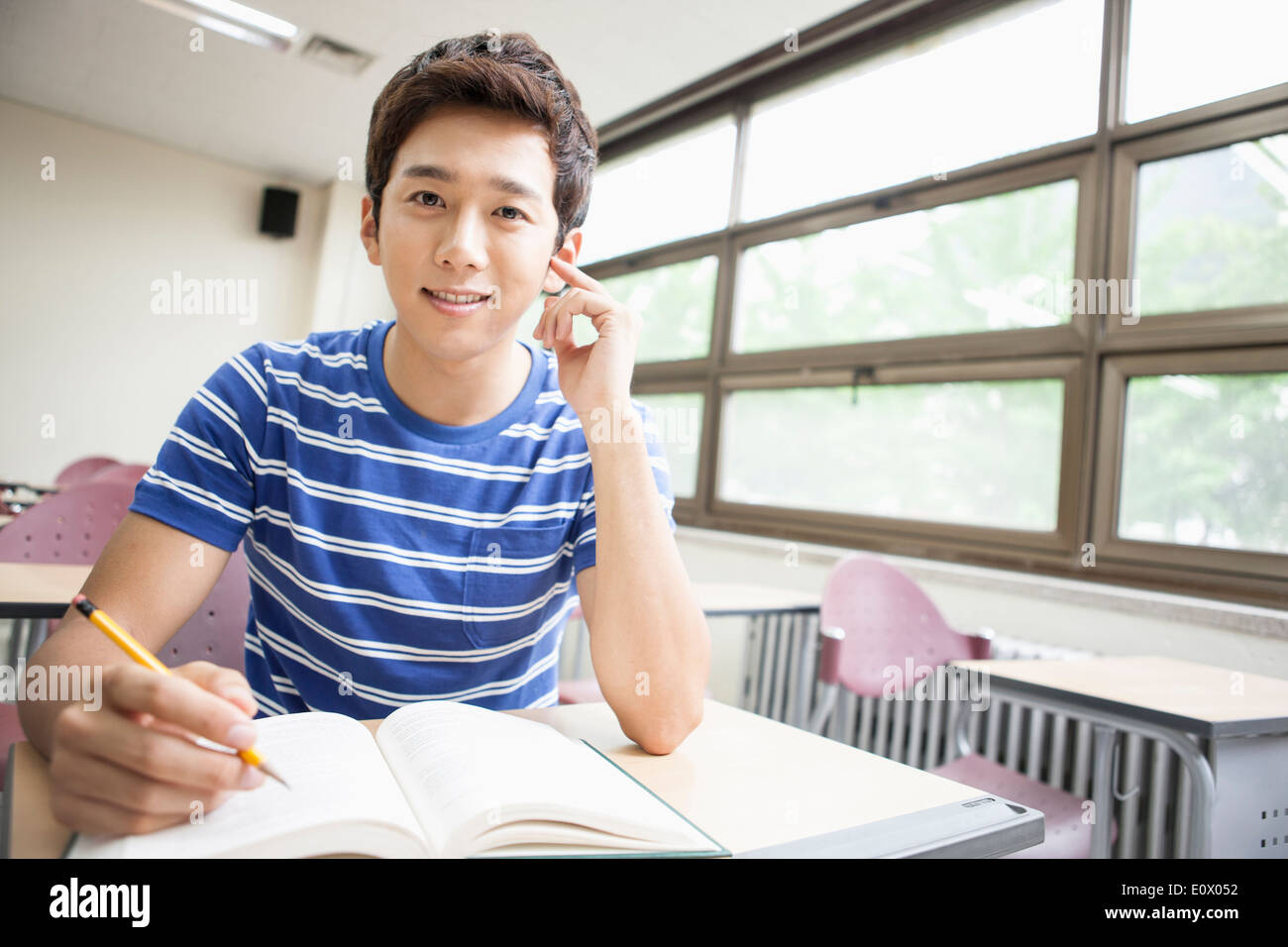 a man studying in class Stock Photo - Alamy