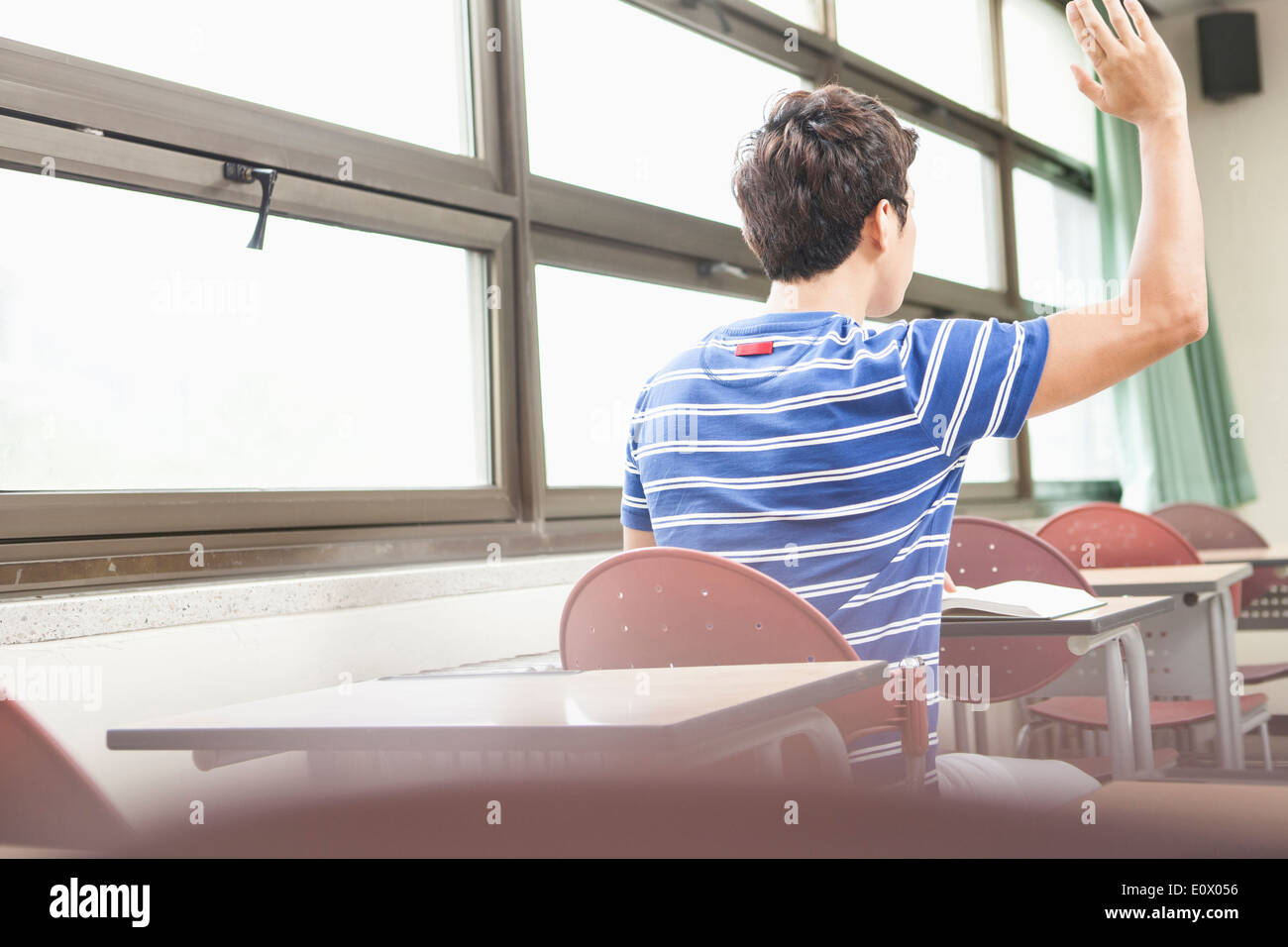 Studying student in blue hi-res stock photography and images - Alamy