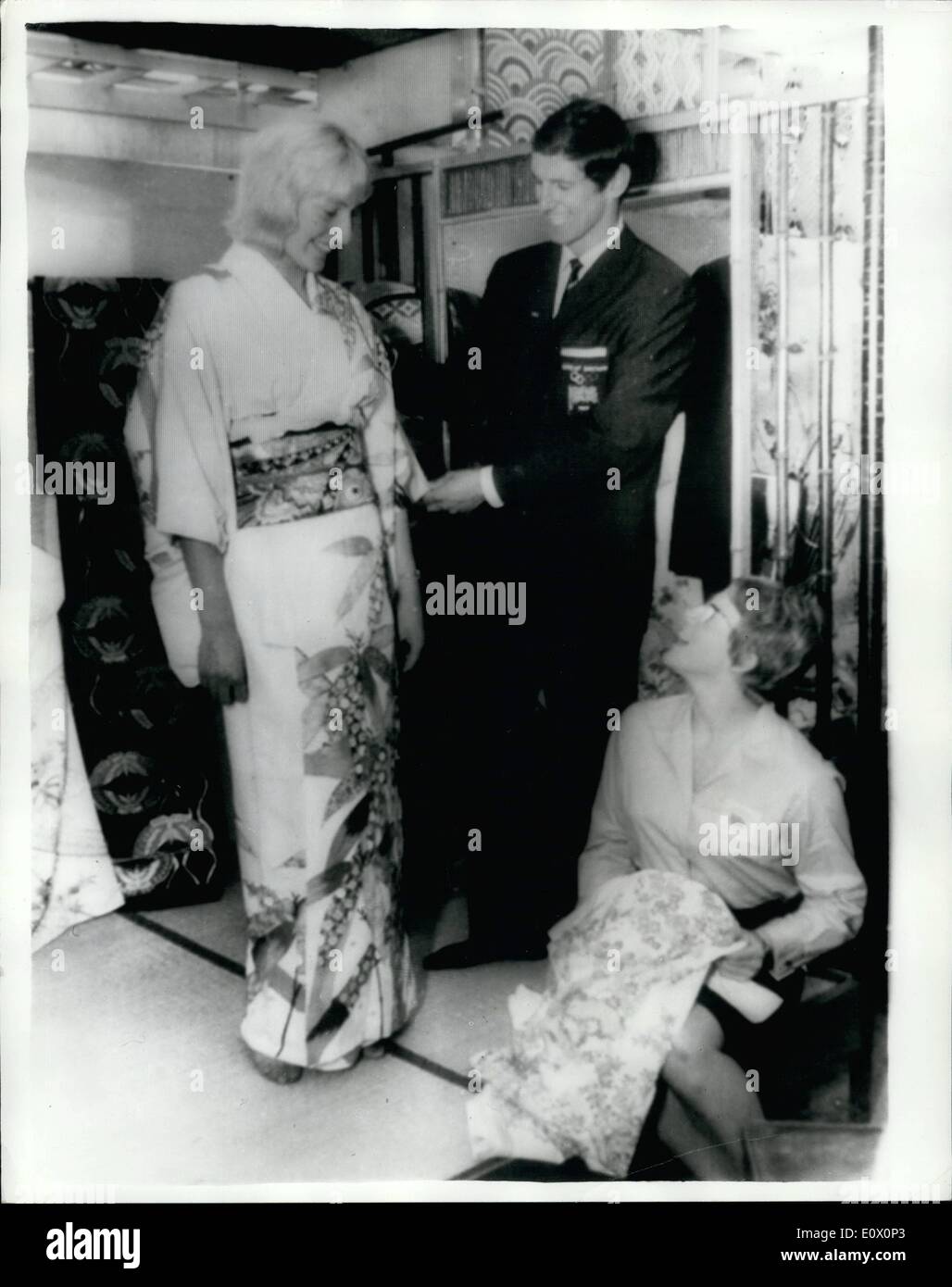 Oct. 07, 1964 - 7-10-64 British girl Olympic swimmer tries on a kimono ...