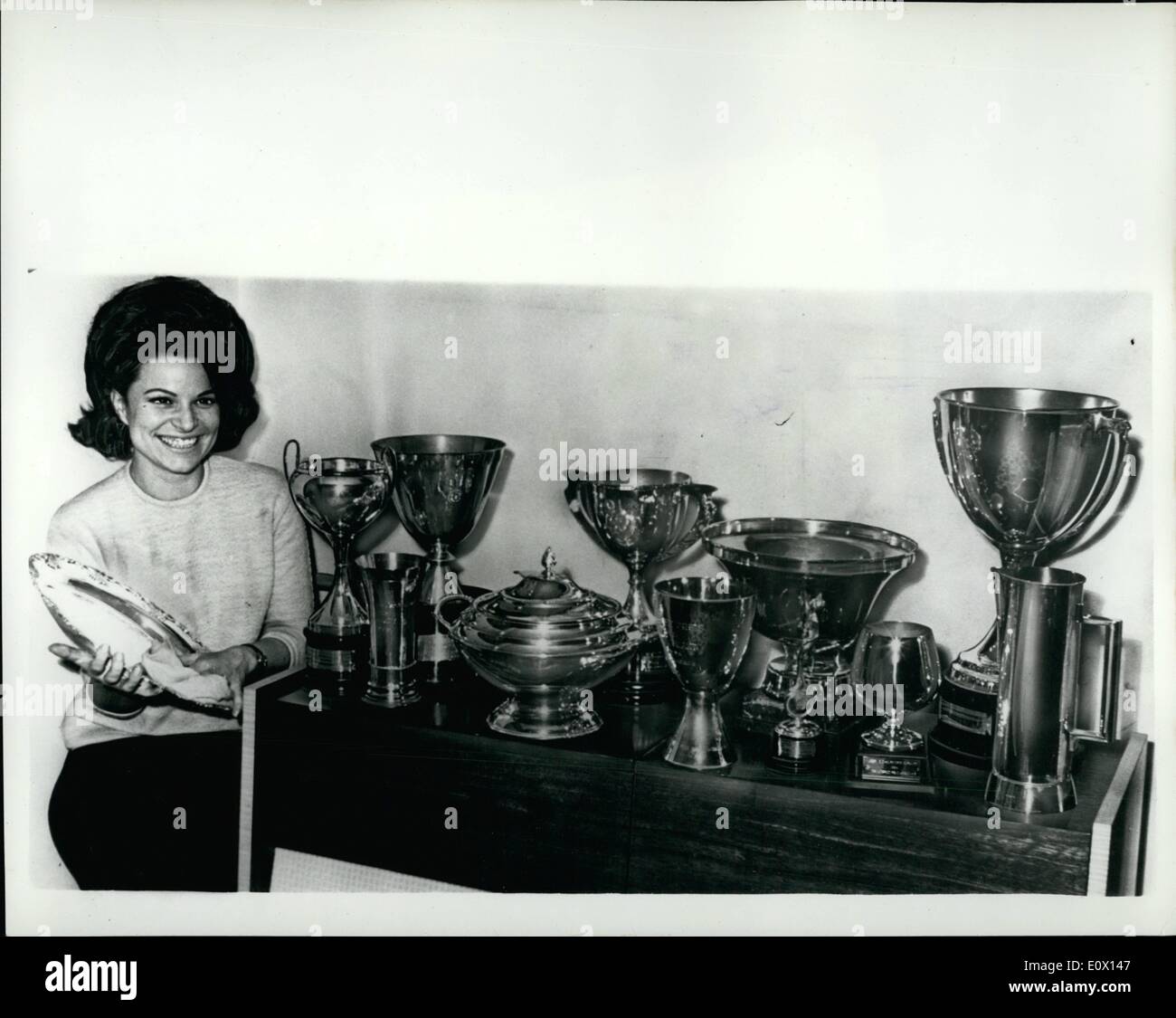 Oct. 10, 1964 - Pat Surtees shines her husband's trophies.: 25-year old ...