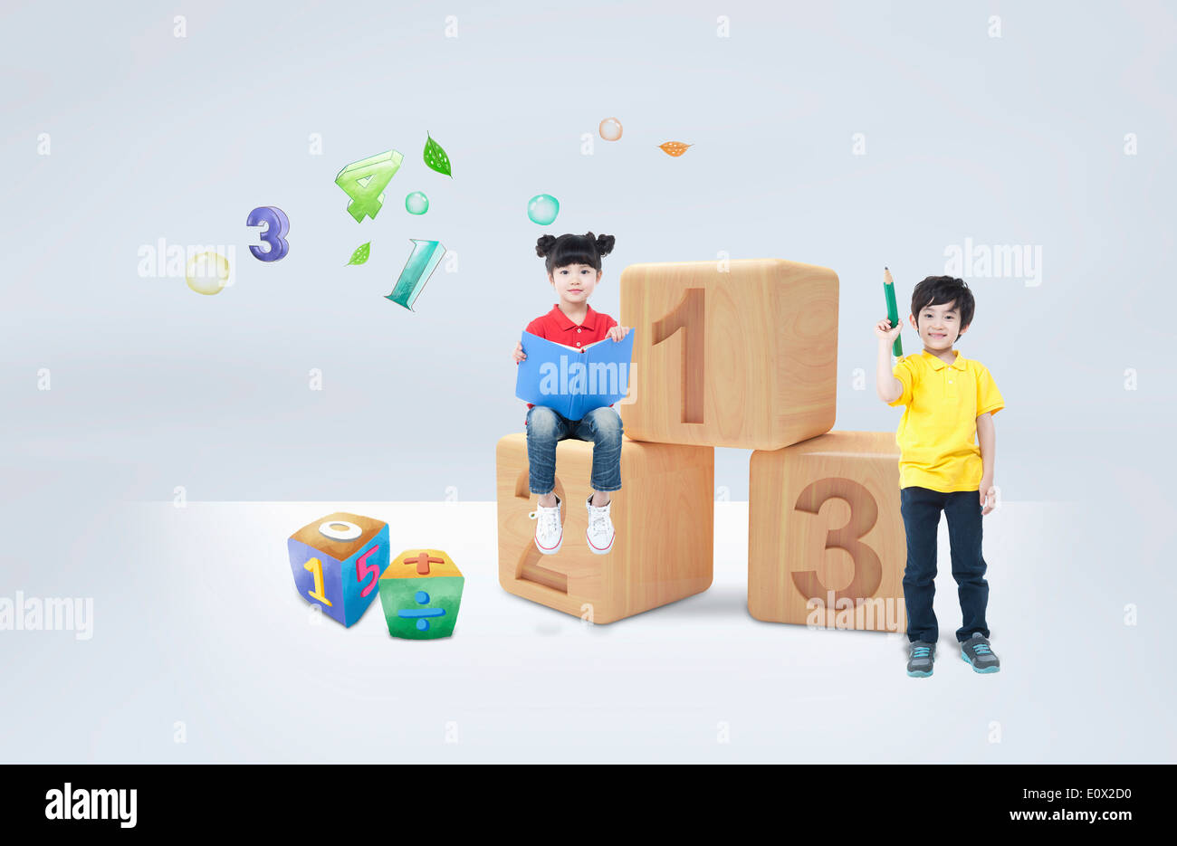 children playing next to cubes with numbers Stock Photo - Alamy