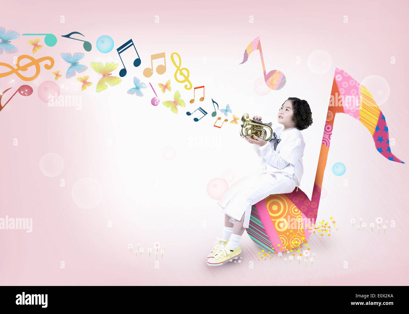 a girl sitting on a musical note Stock Photo - Alamy