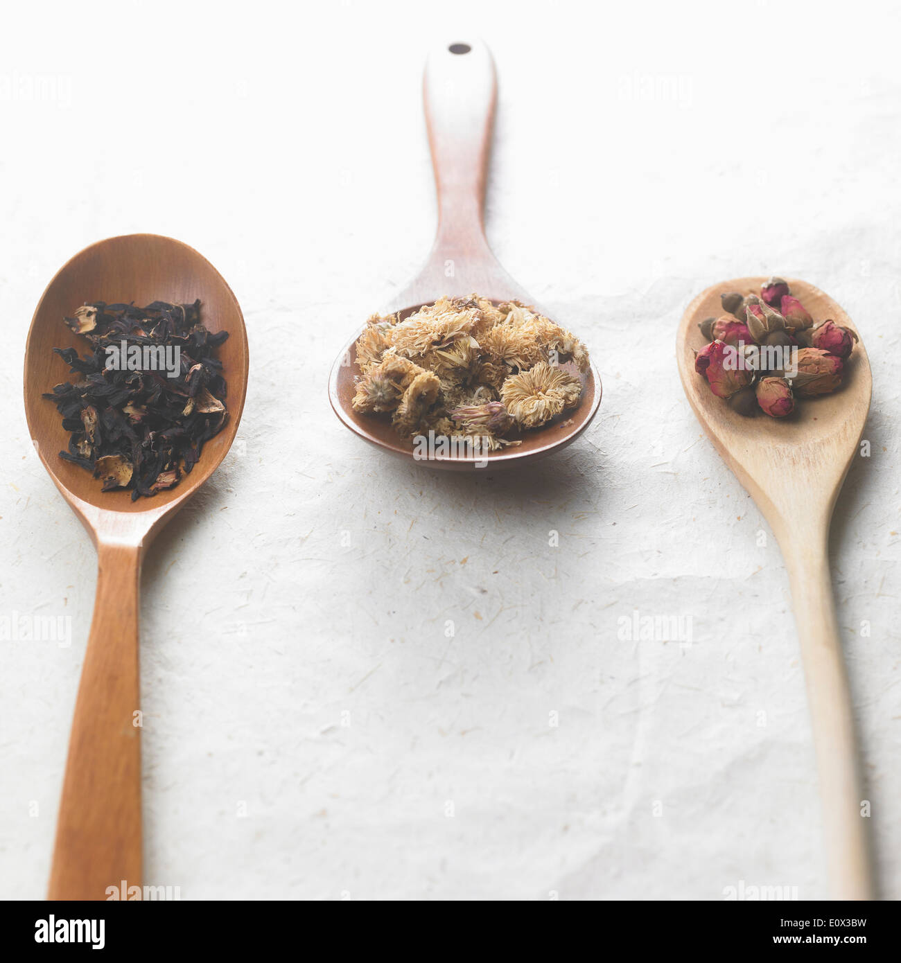 three spoons of different herbs on the table Stock Photo - Alamy