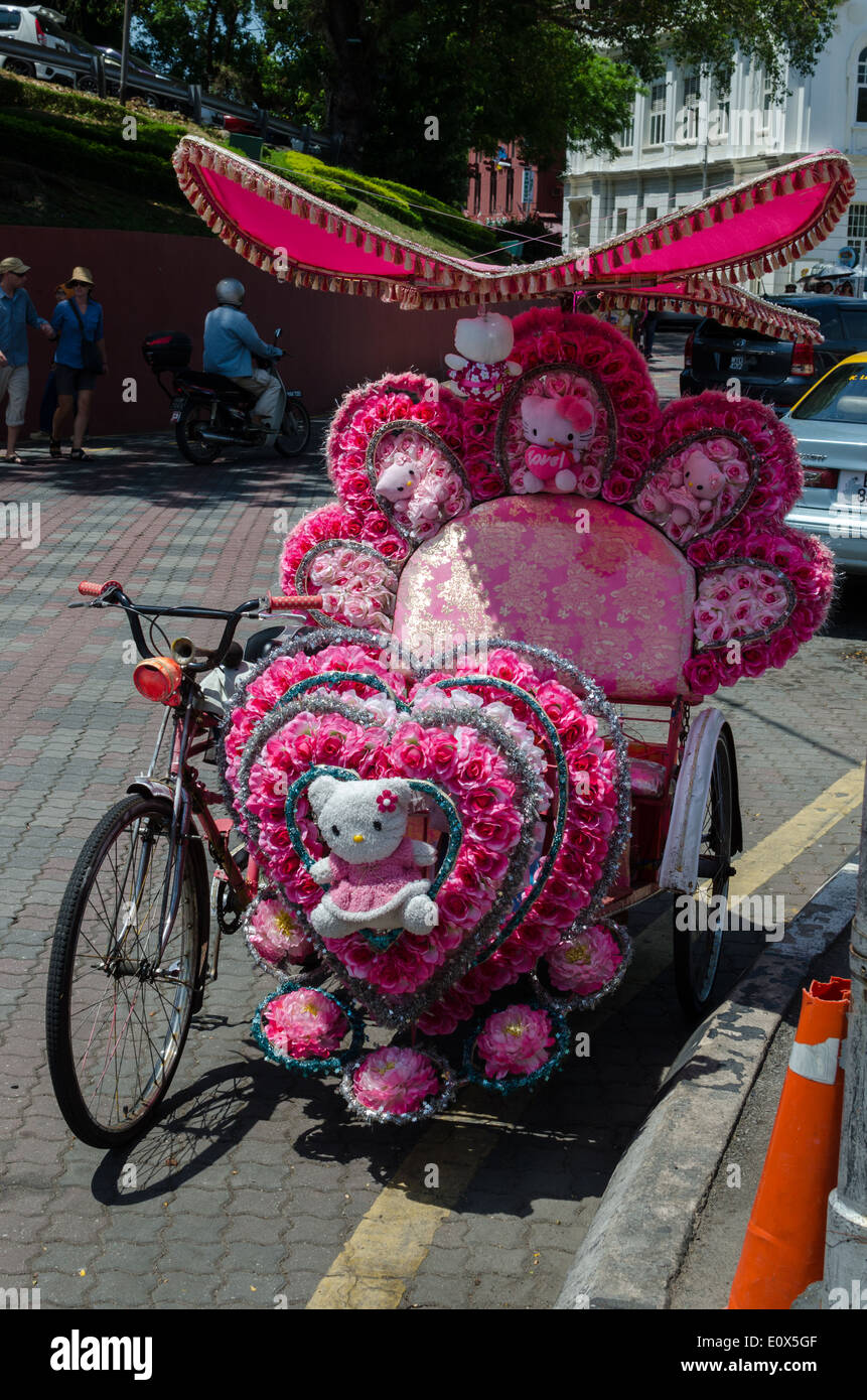 A pink highly decorated Trishaw in the Malaysian city of Malacca Stock ...