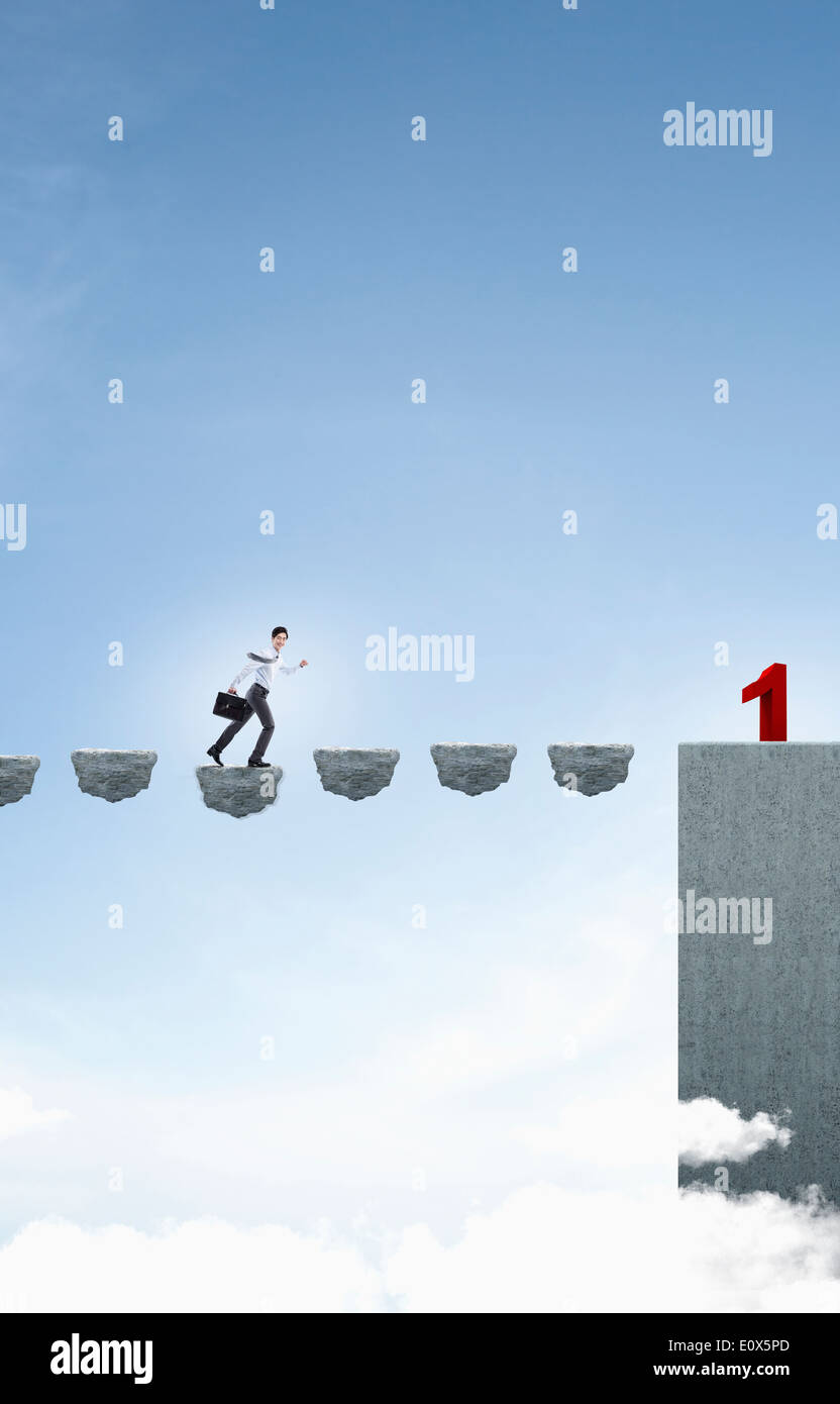 a business man going towards number one Stock Photo - Alamy