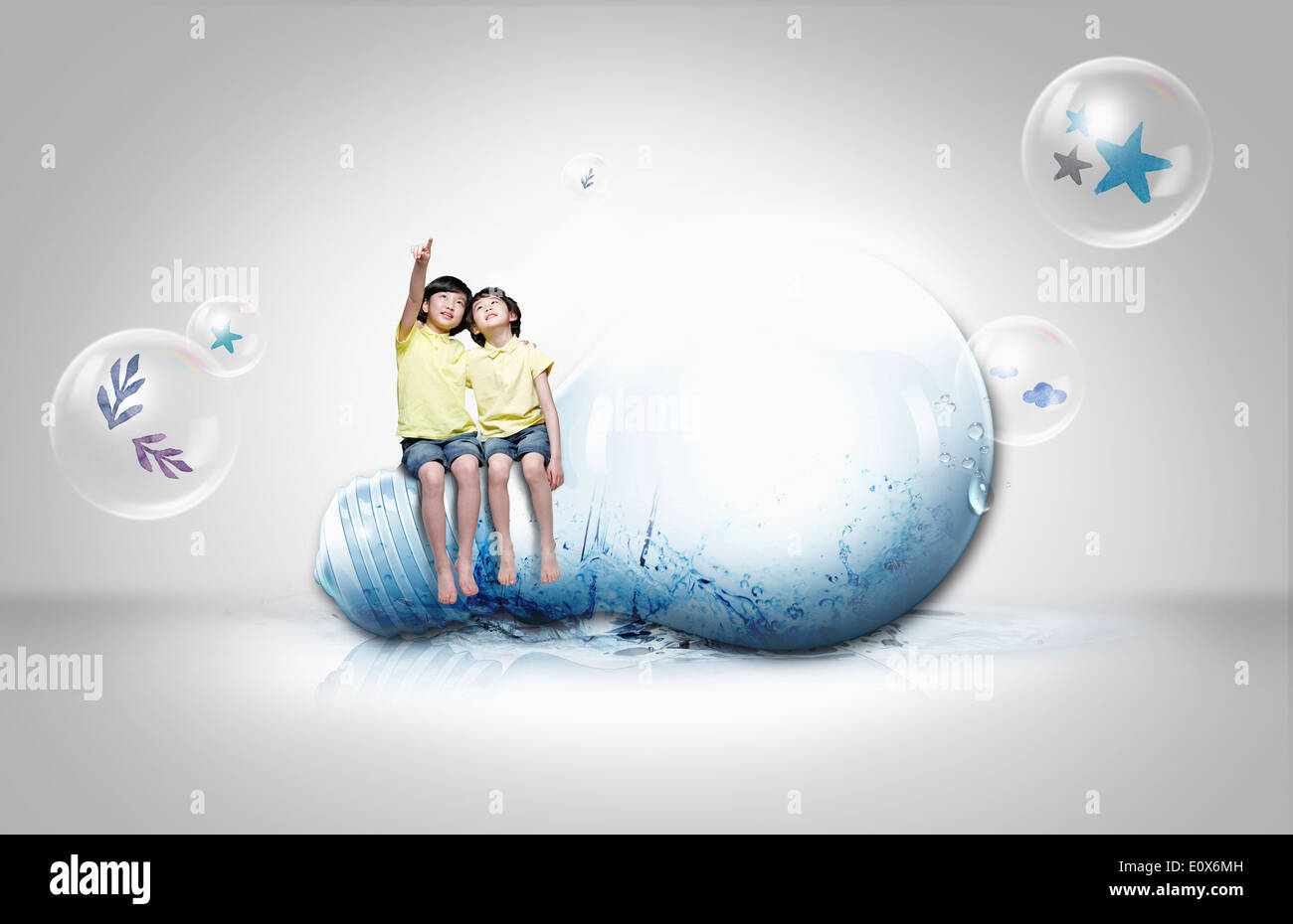 kids sitting on a light bulb Stock Photo - Alamy