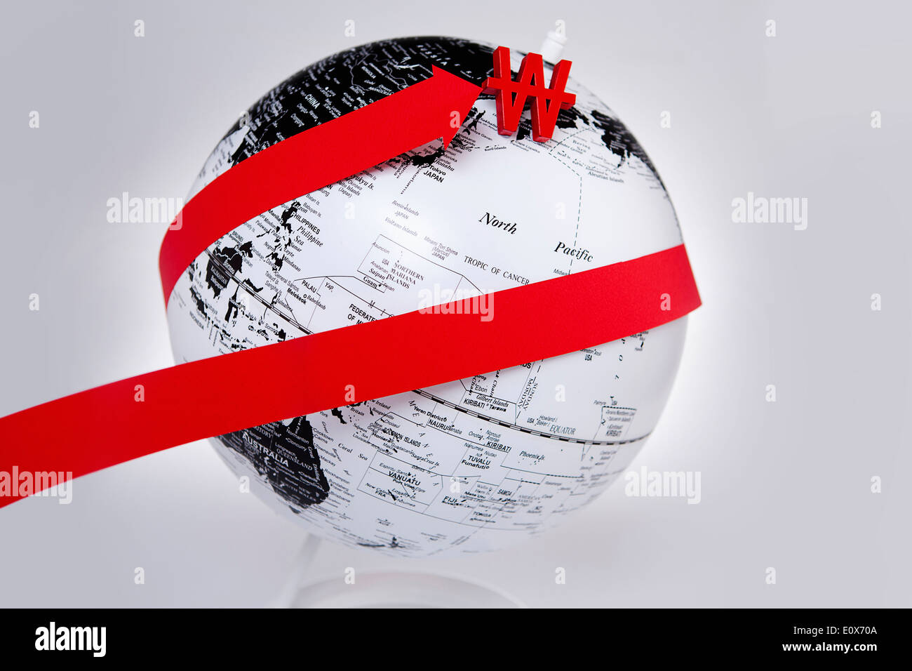 the globe wrapped in a red arrow Stock Photo - Alamy
