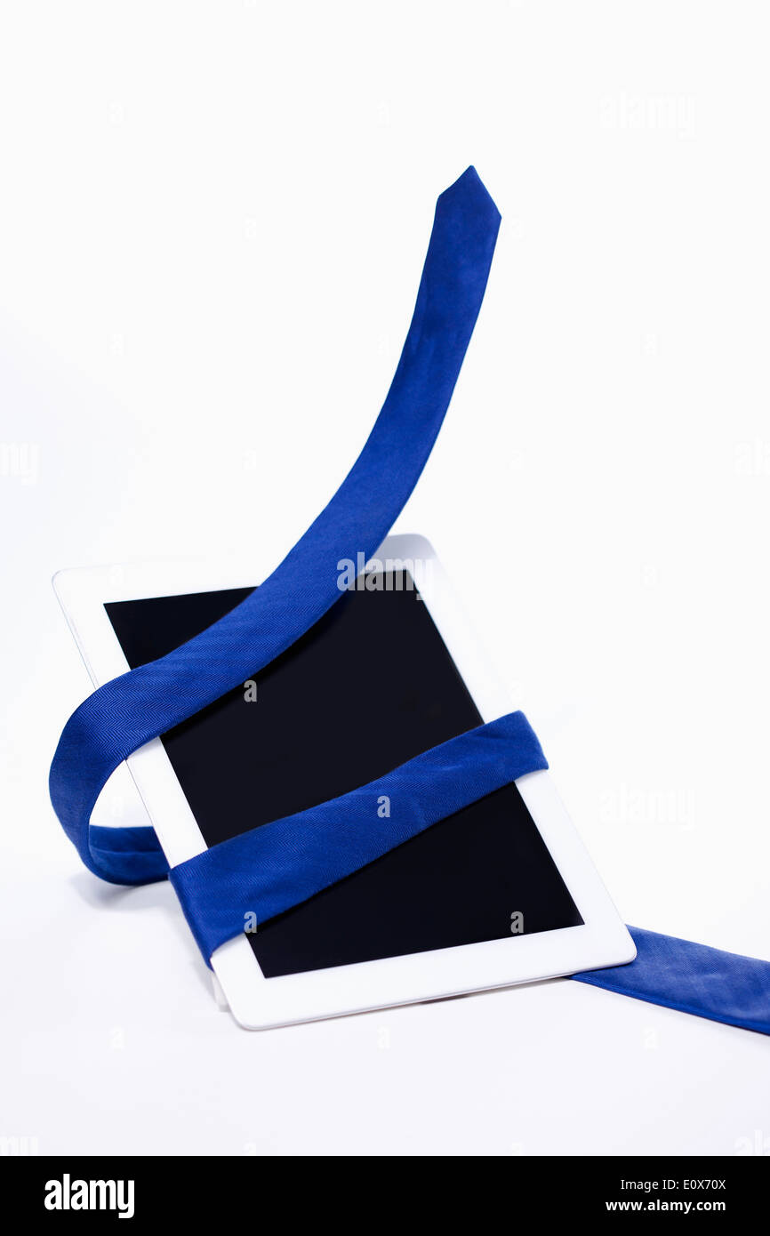 a tablet wrapped in a blue tie Stock Photo - Alamy