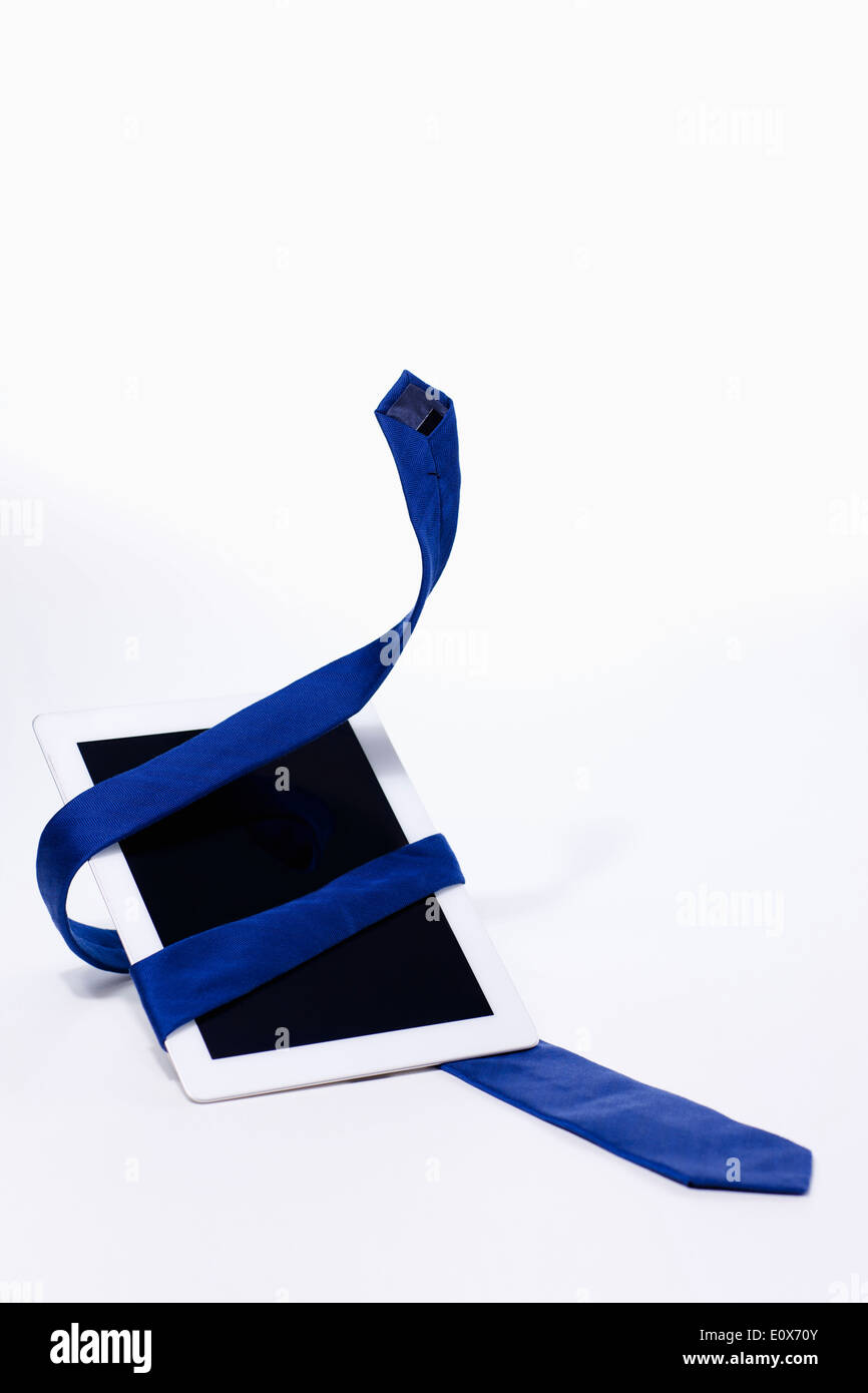 a tablet wrapped in a blue tie Stock Photo - Alamy