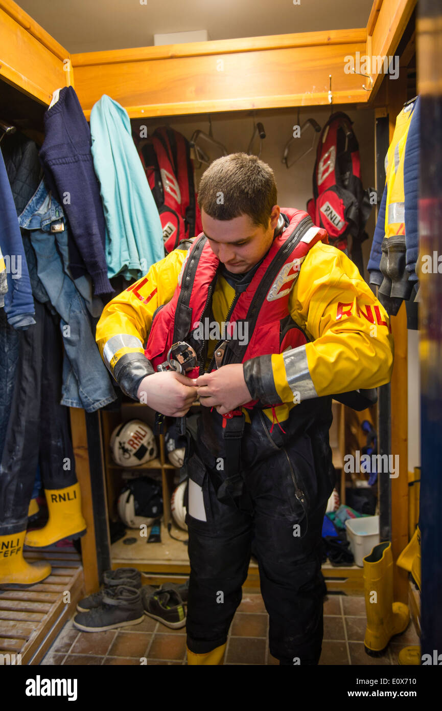 A RNLI Royal National Lifeboat Institution volunteer crew member ...