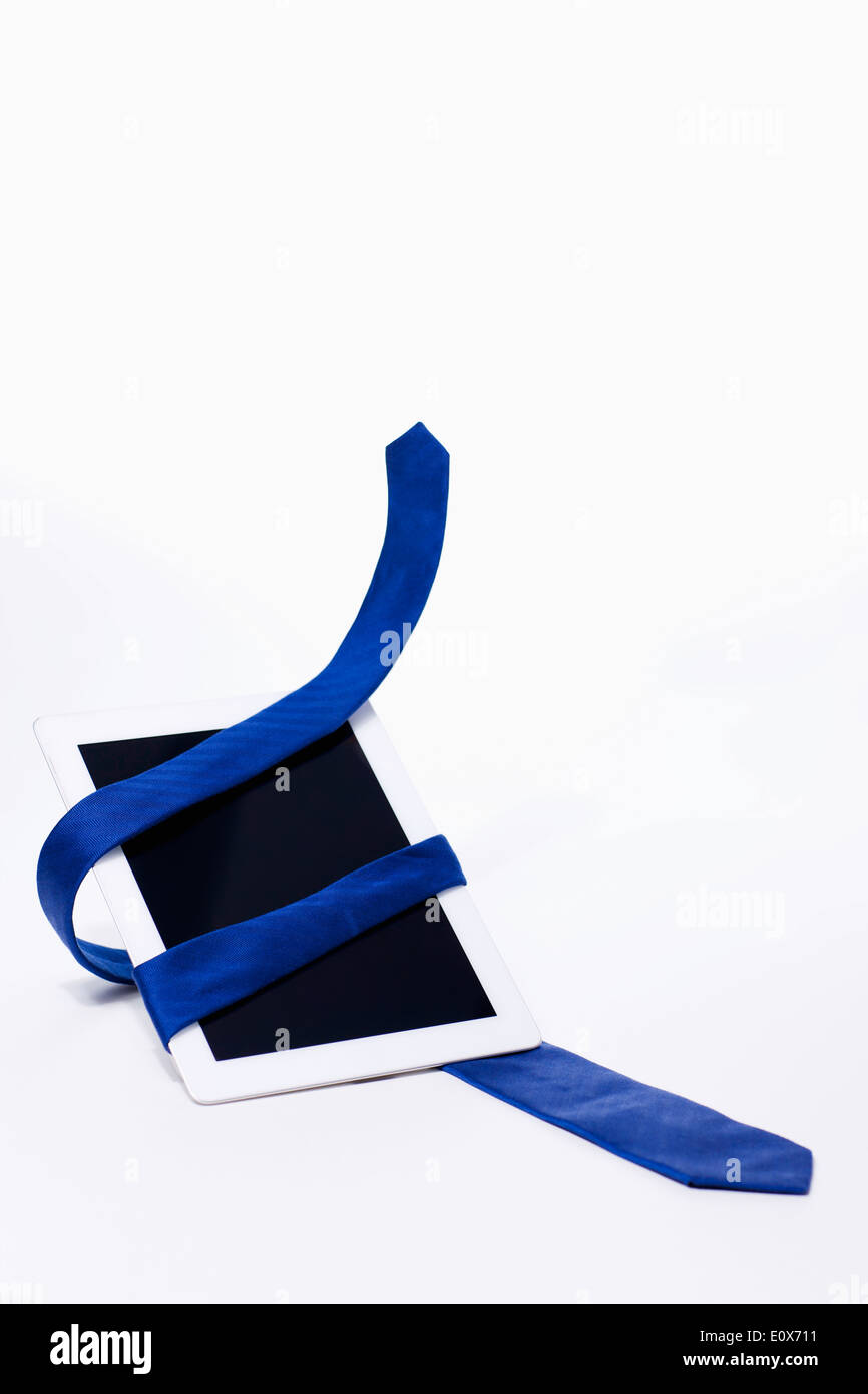 a tablet wrapped in a blue tie Stock Photo - Alamy
