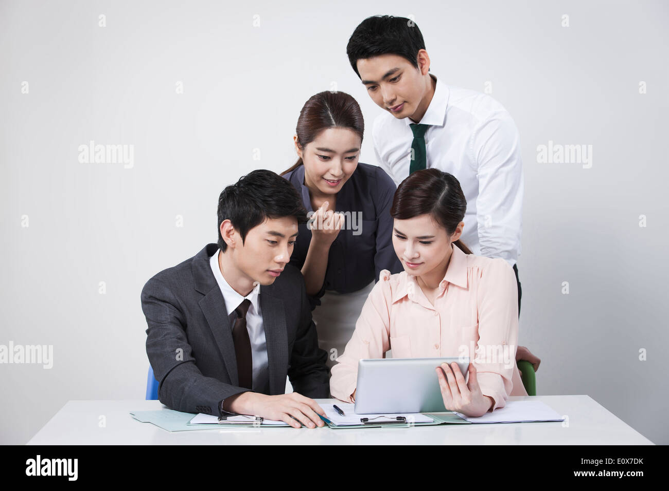two business women and two business men working together Stock Photo ...