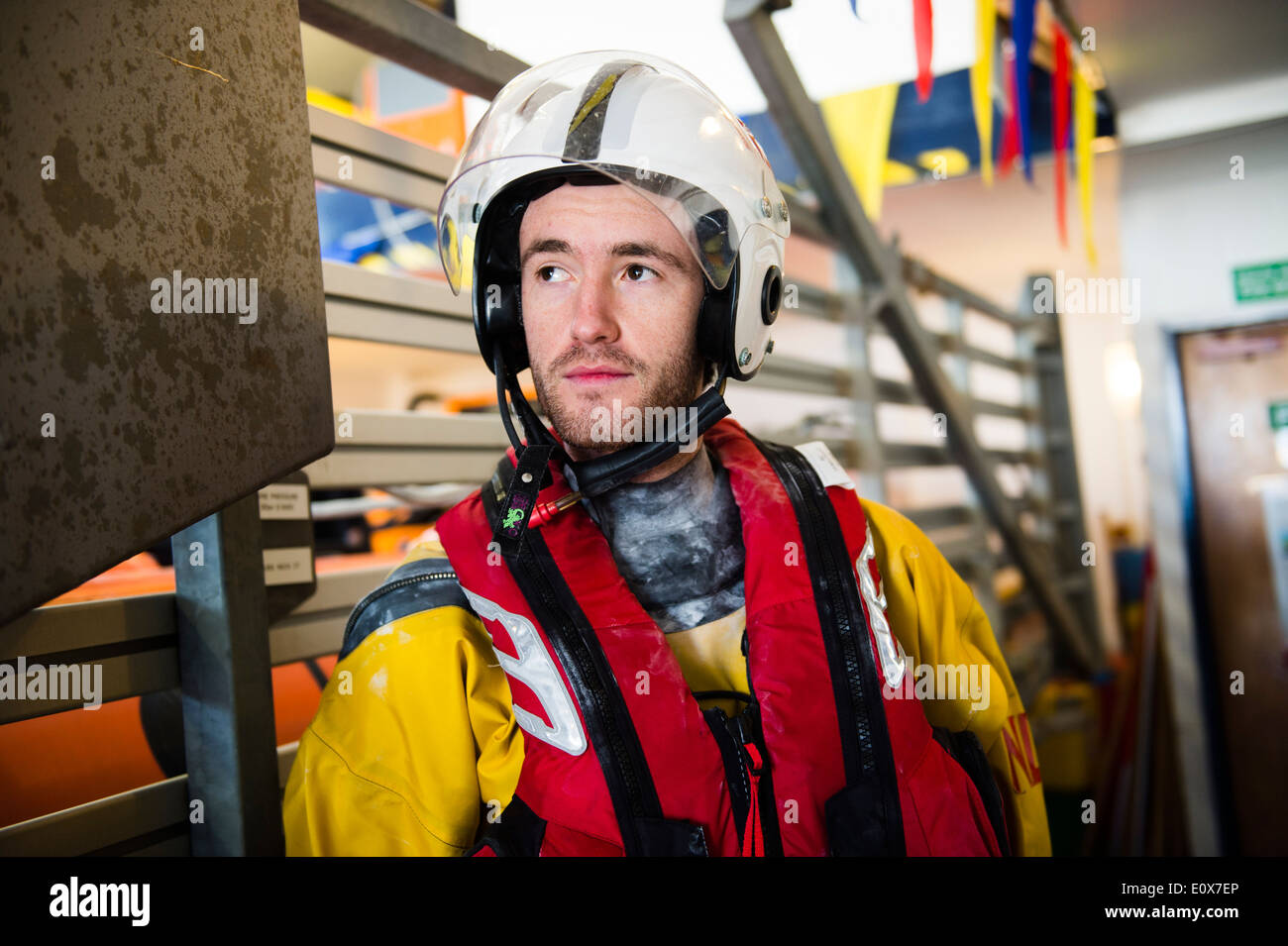 A RNLI Royal National Lifeboat Institution volunteer crew member ...