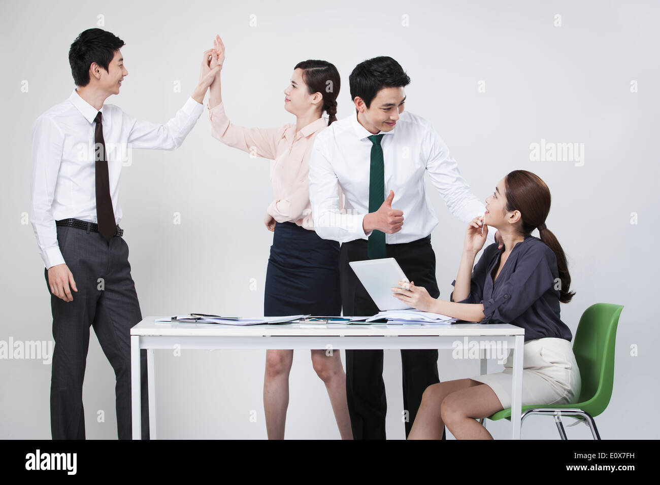 two business women and two business men solved a problem Stock Photo ...