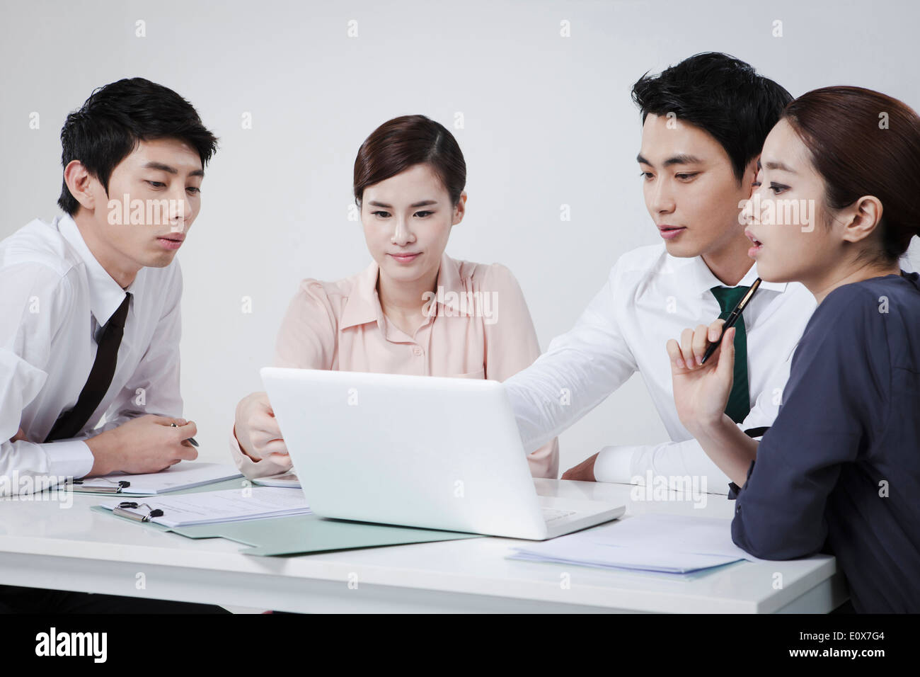 Working around a table hi-res stock photography and images - Alamy